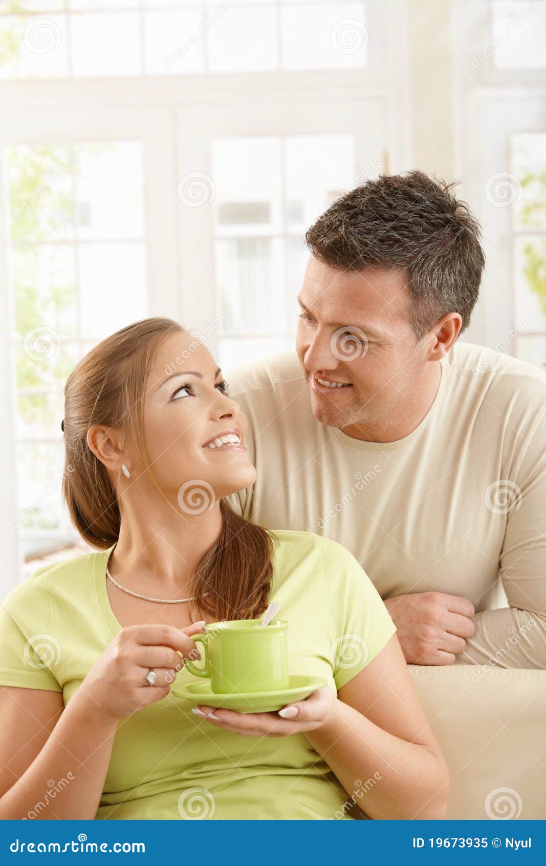 Happy couple with tea cup stock image. Image of cosy - 19673935