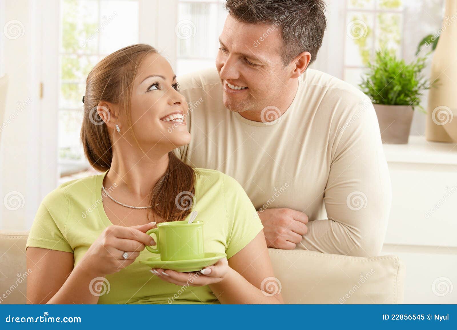 Happy couple with tea cup stock image. Image of cosy - 22856545
