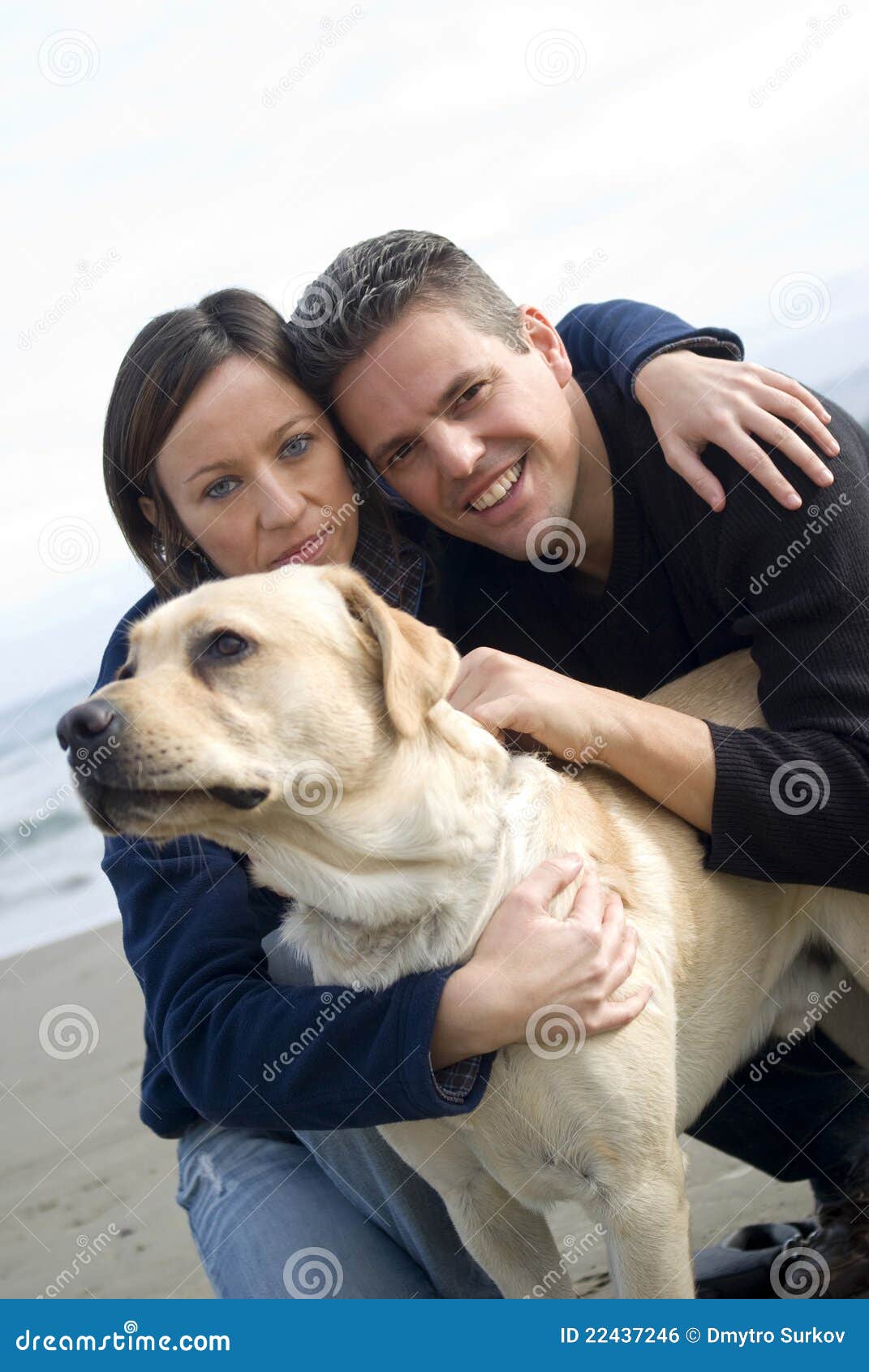 Happy Couple with Their Dog Stock Photo - Image of embraced, female ...