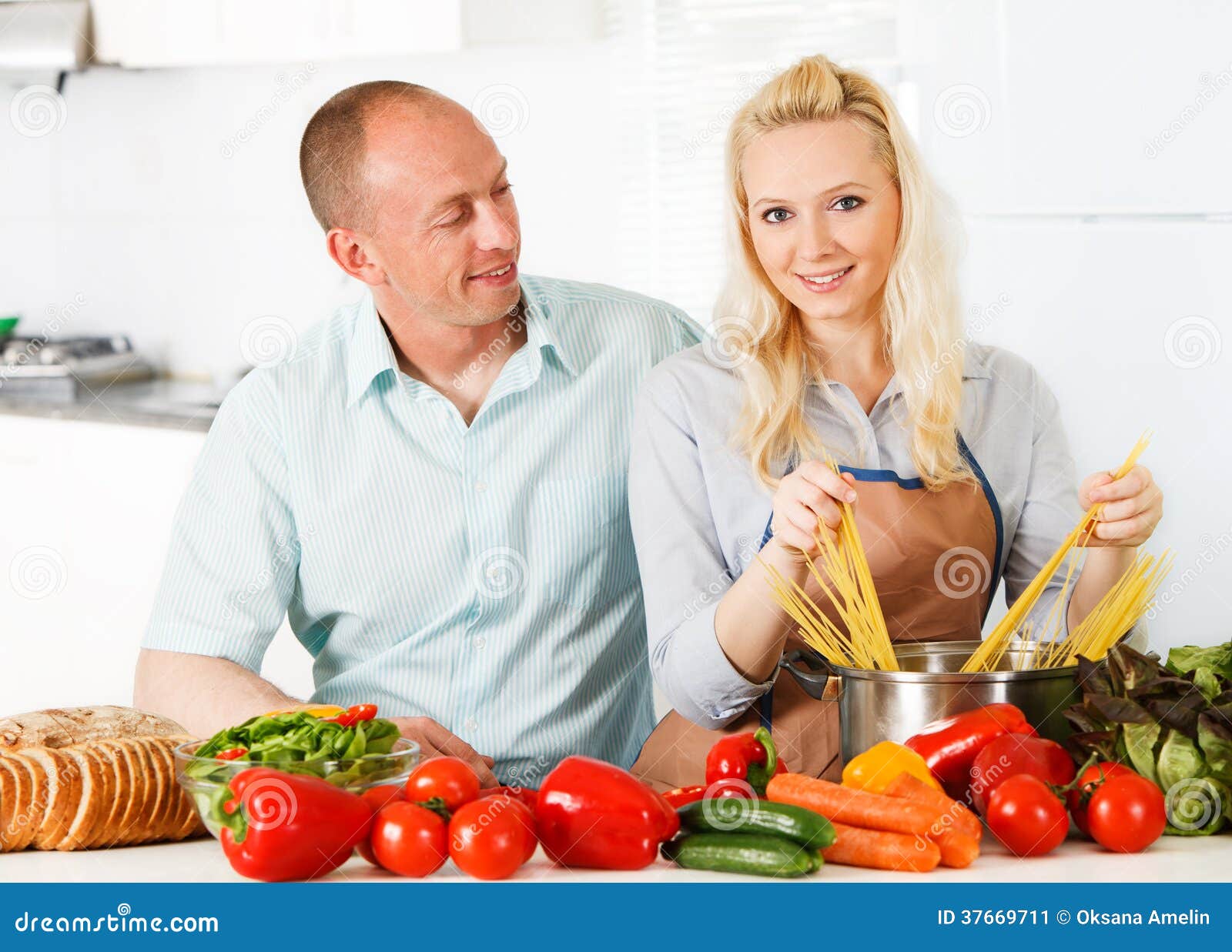Happy Couple in Their Kitchen Stock Image - Image of dress, caucasian ...