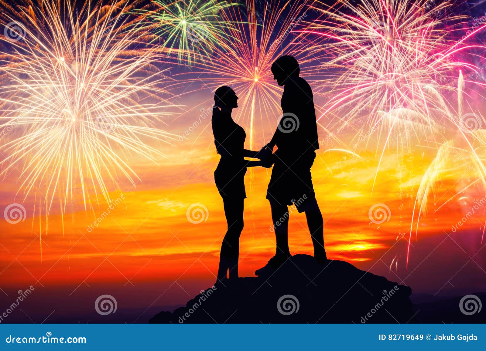Happy Couple Together on Rock and Watching the Fireworks Stock Image ...