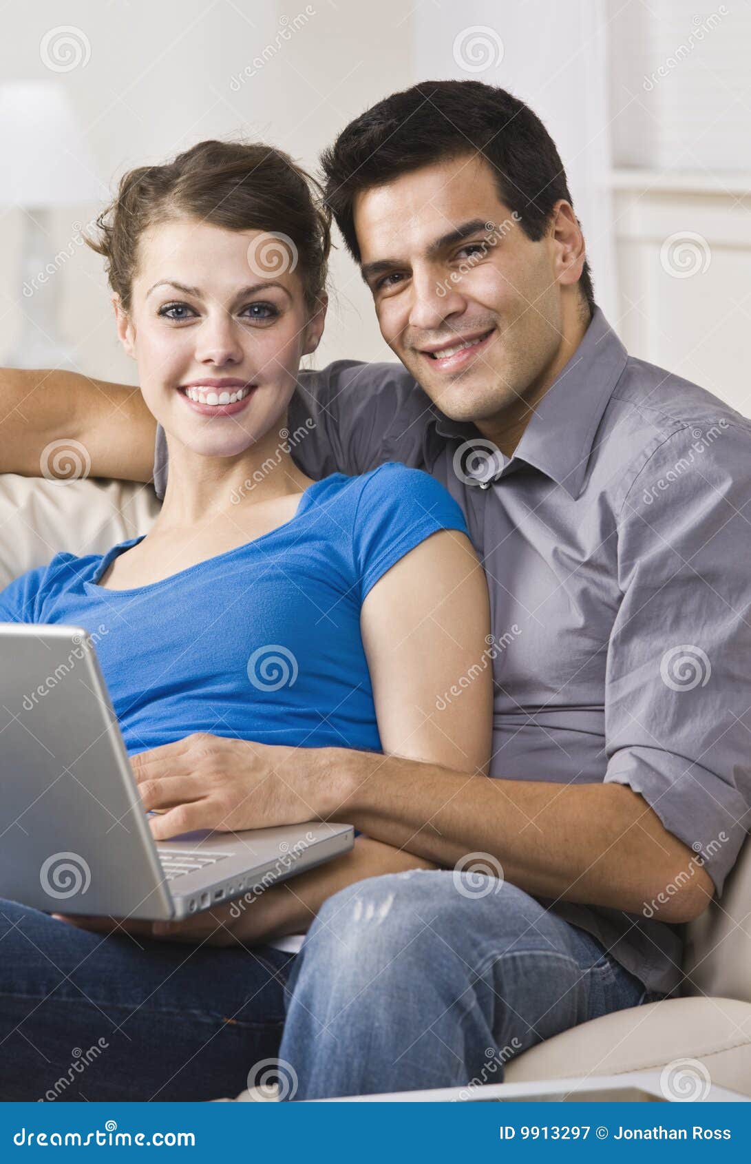 Happy Couple Using Laptop stock image. Image of computer - 9913297