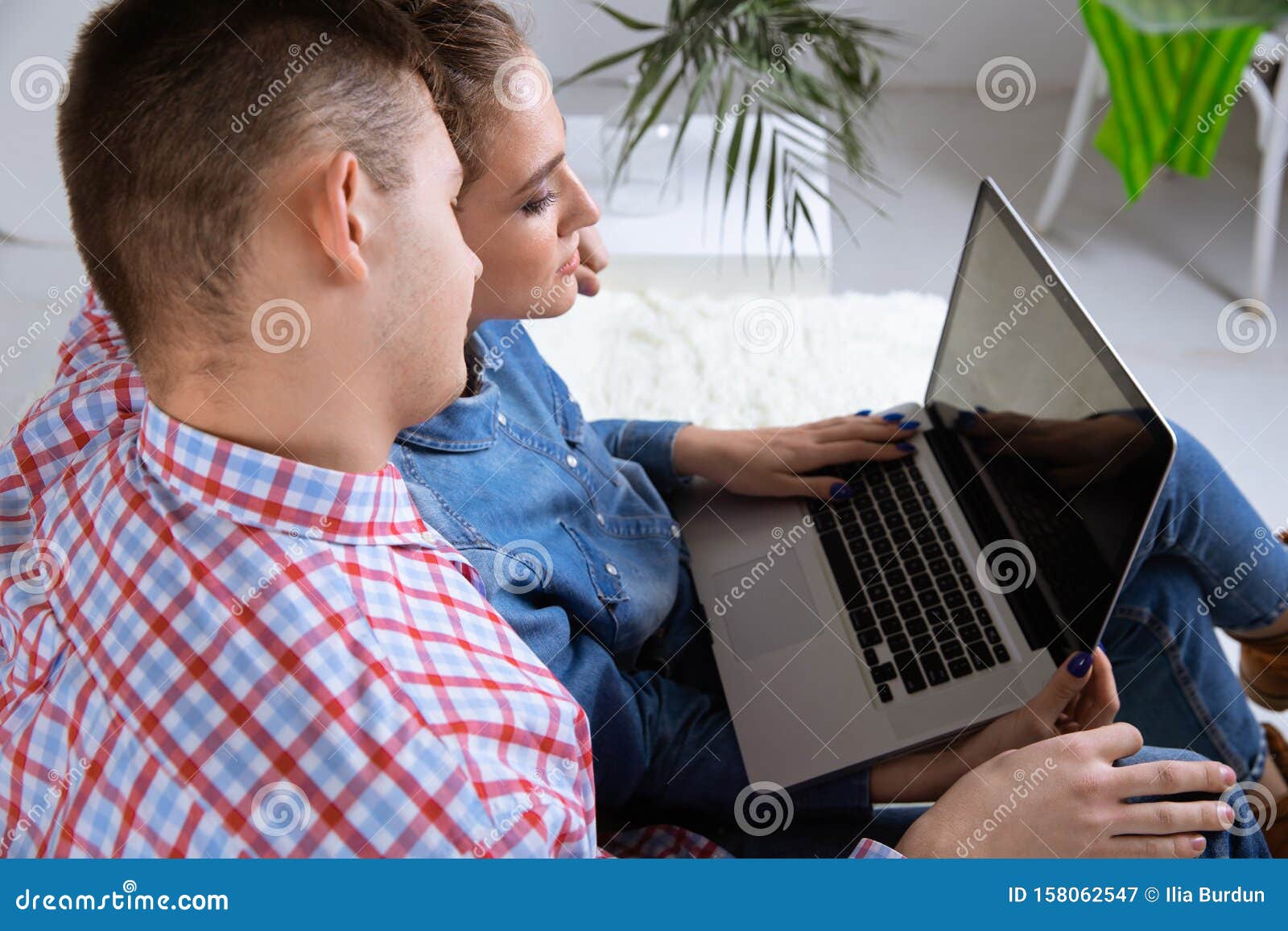 Happy Couple Using Laptop Together Online. Stock Image - Image of ...