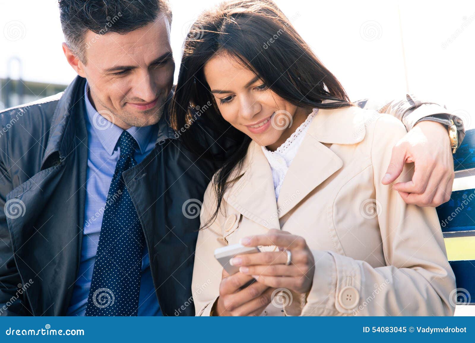 Happy Couple Using Smartphone Together Stock Image - Image of male ...