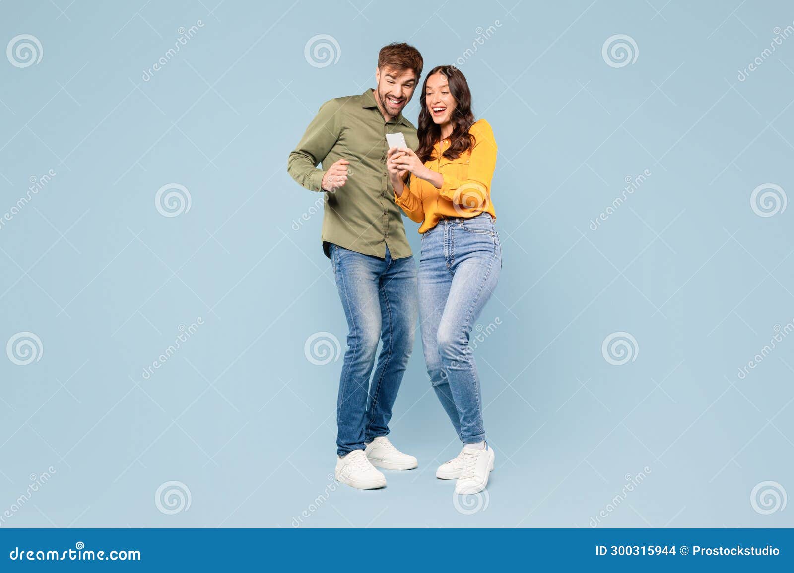Happy Couple Viewing Smartphone Together Joyful Interaction Stock