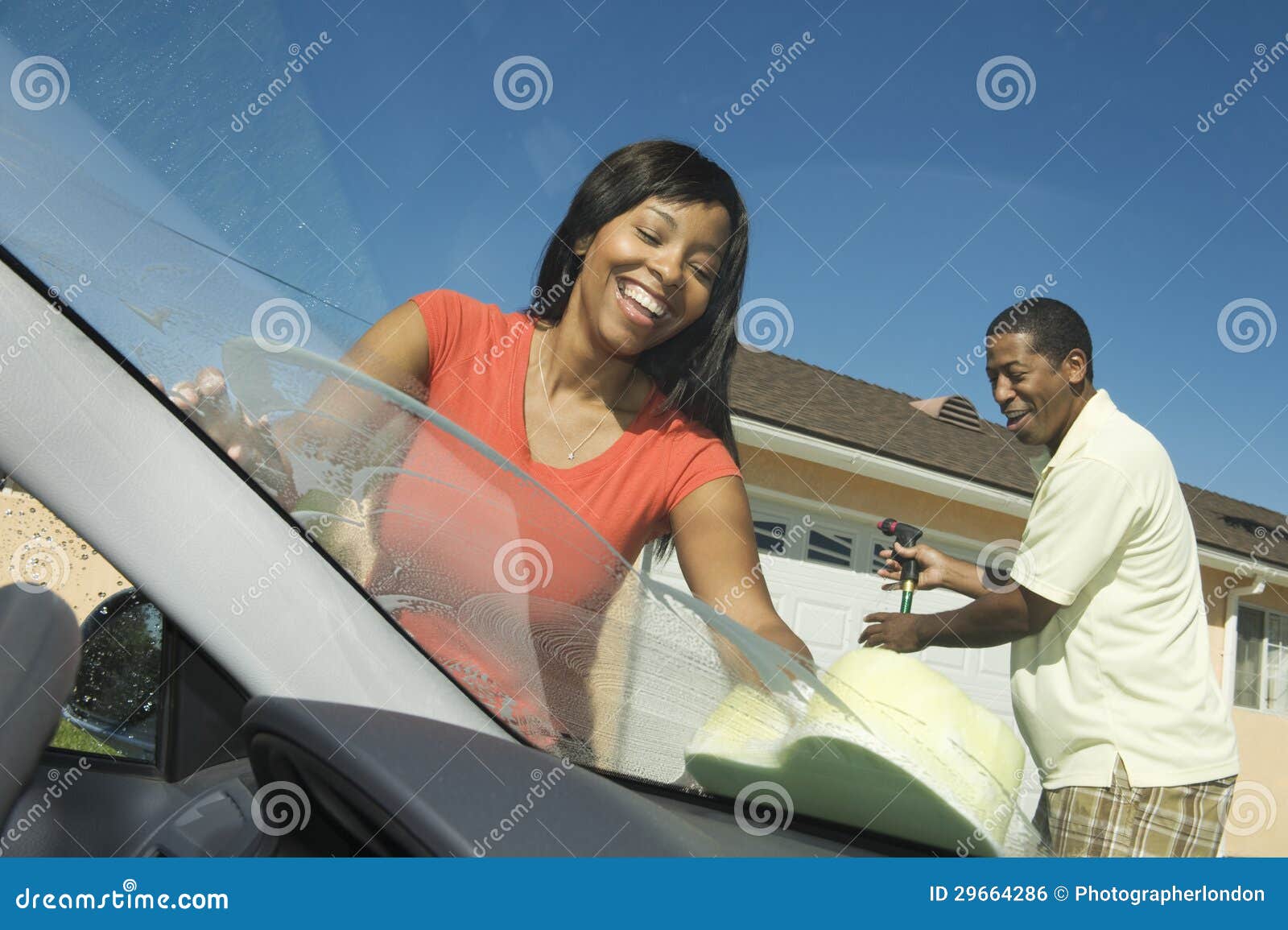 Happy Couple Washing Car stock photo. Image of togetherness - 29664286