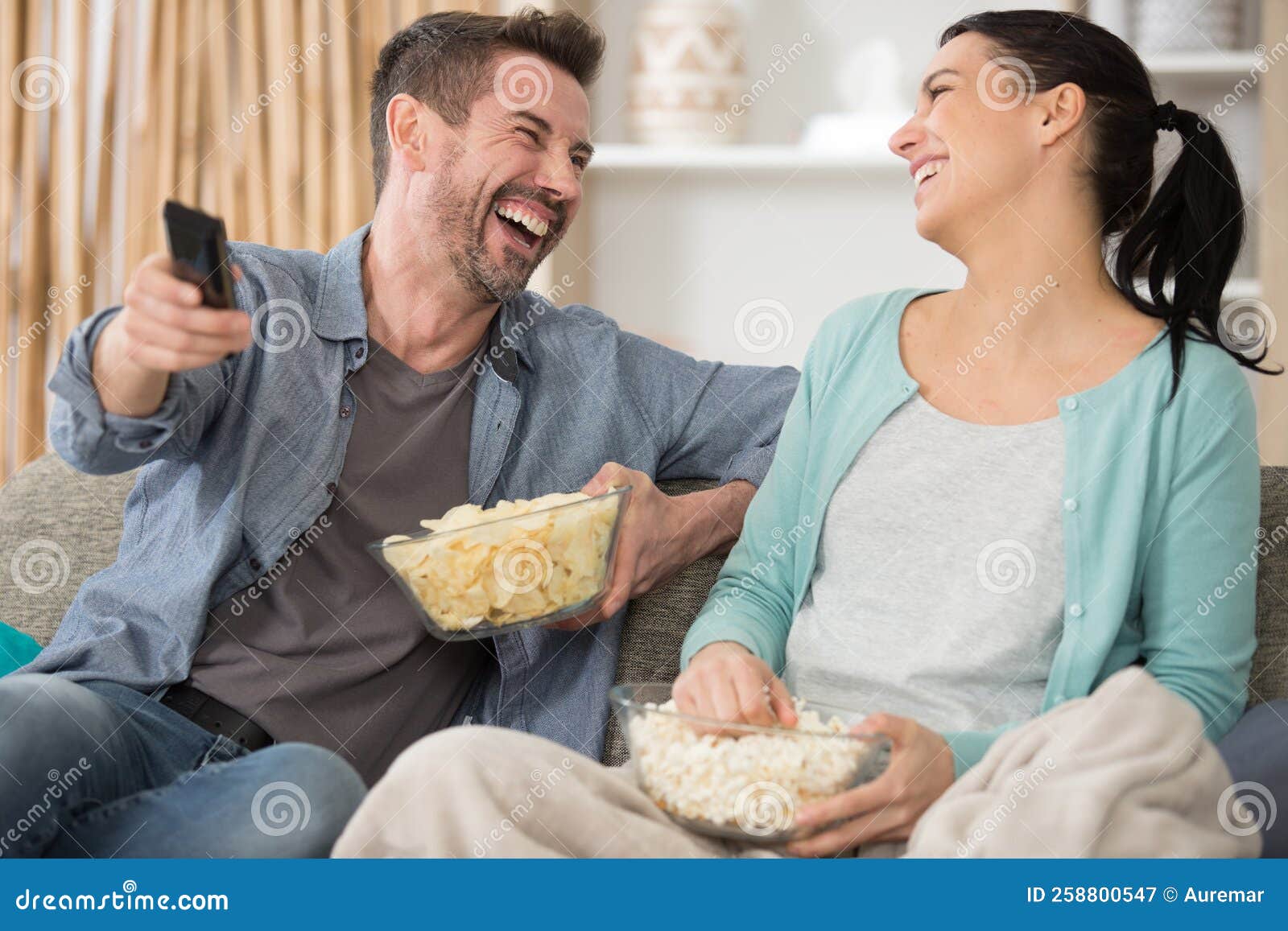 Happy Couple Watching Tv and Eating Pop-corn Stock Image - Image of ...