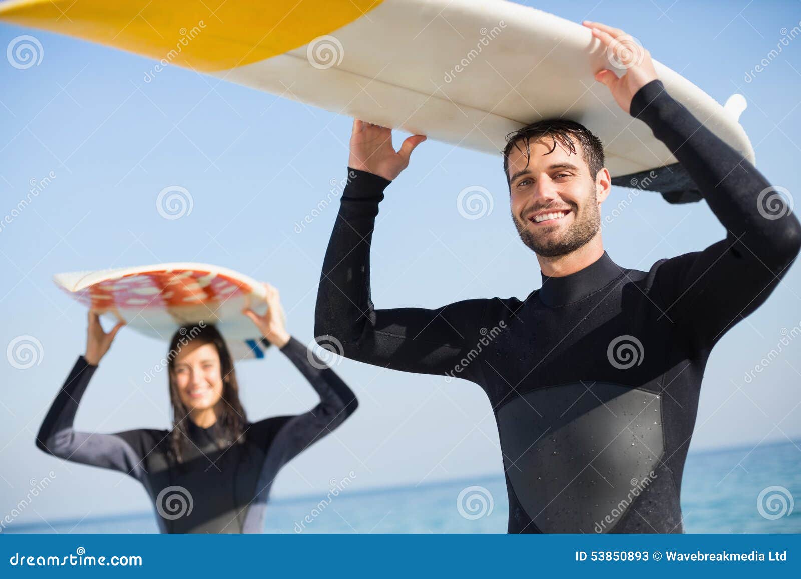 Happy Couple in Wetsuits with Surfboard on a Sunny Day Stock Image ...