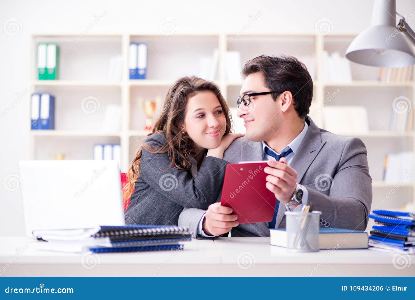 The Happy Couple Working in the Same Office Stock Photo - Image of ...