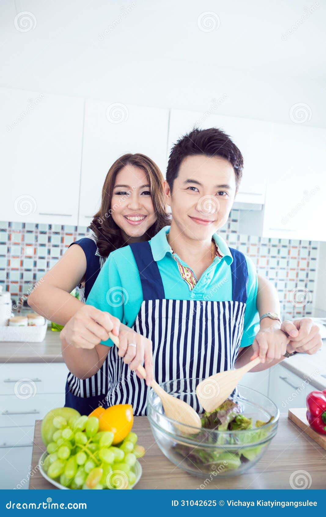 Happy couples in kitchen stock image. Image of family - 31042625