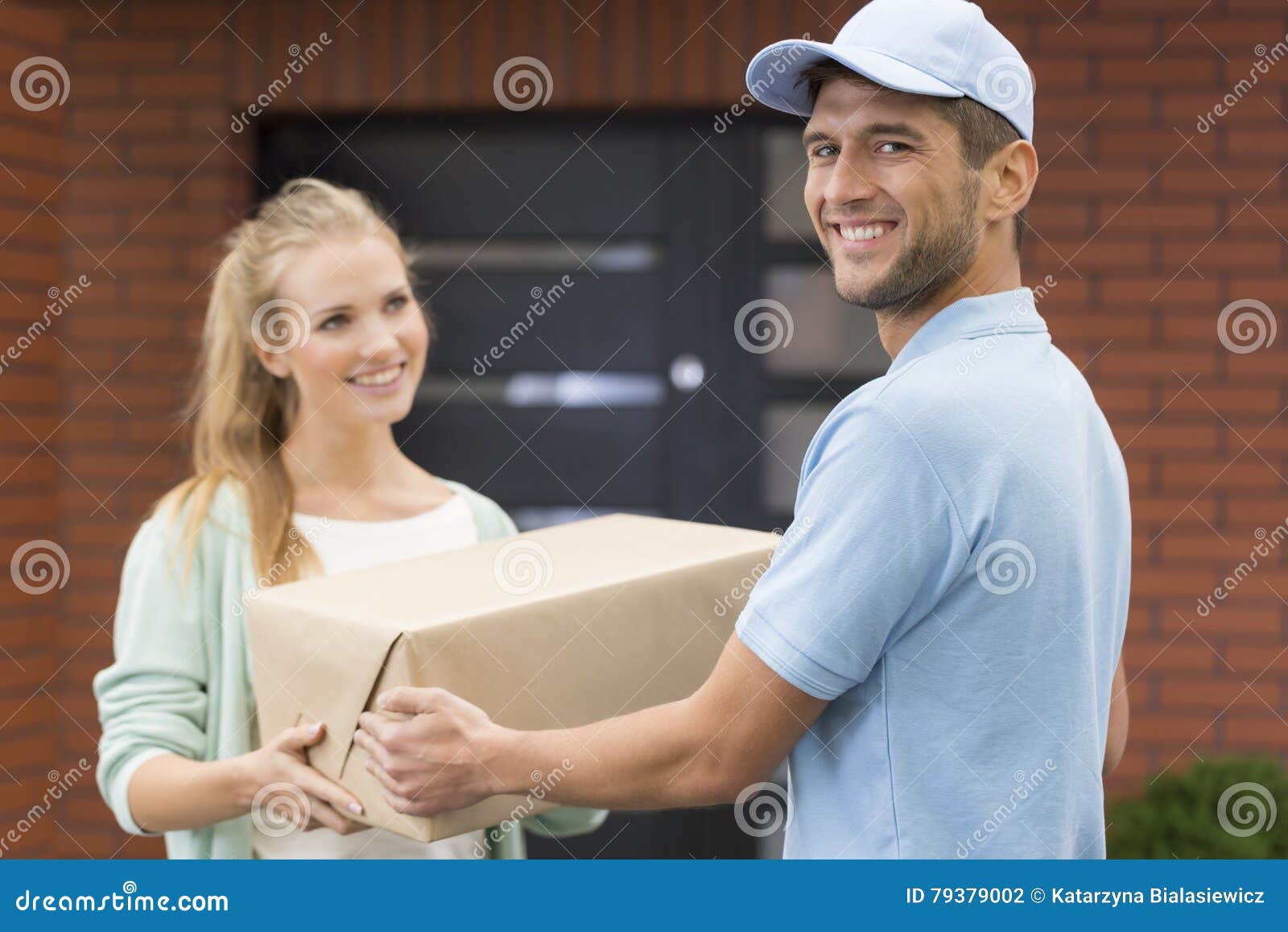 Happy Courier Delivering a Package Stock Photo - Image of outdoors ...