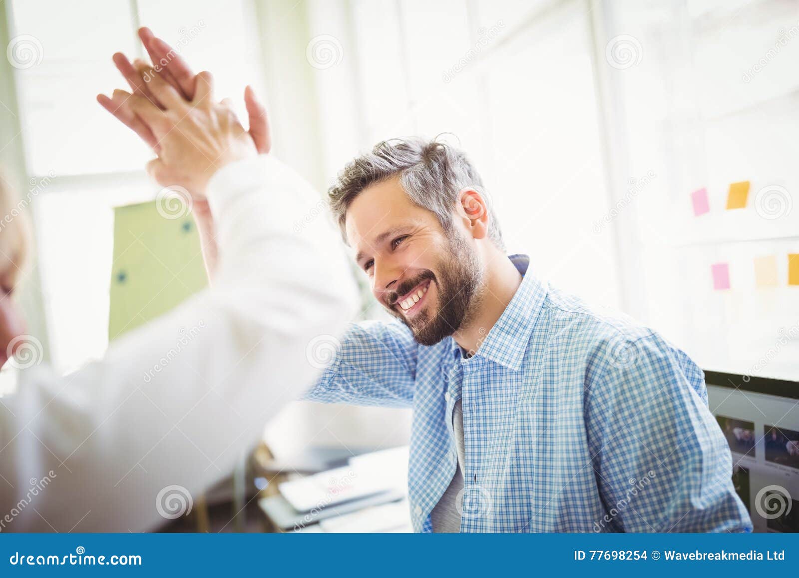Happy Coworkers Giving High-five in Creative Office Stock Photo - Image ...