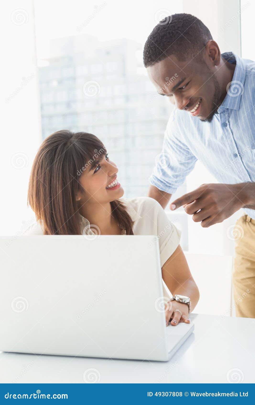 Happy Coworkers Using Laptop Together Stock Photo - Image of corporate ...