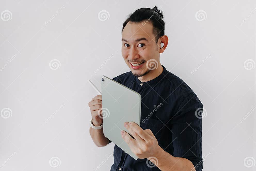 Happy Creative Freelance Man with Earbuds Work with Tablet Isolate on ...