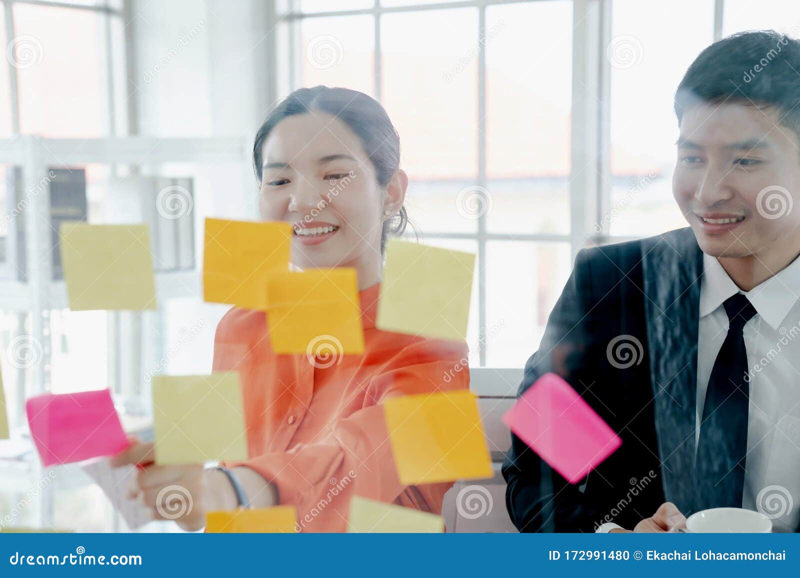 Happy People Making Mind Map on a Glass Wall in the Office Stock Photo ...