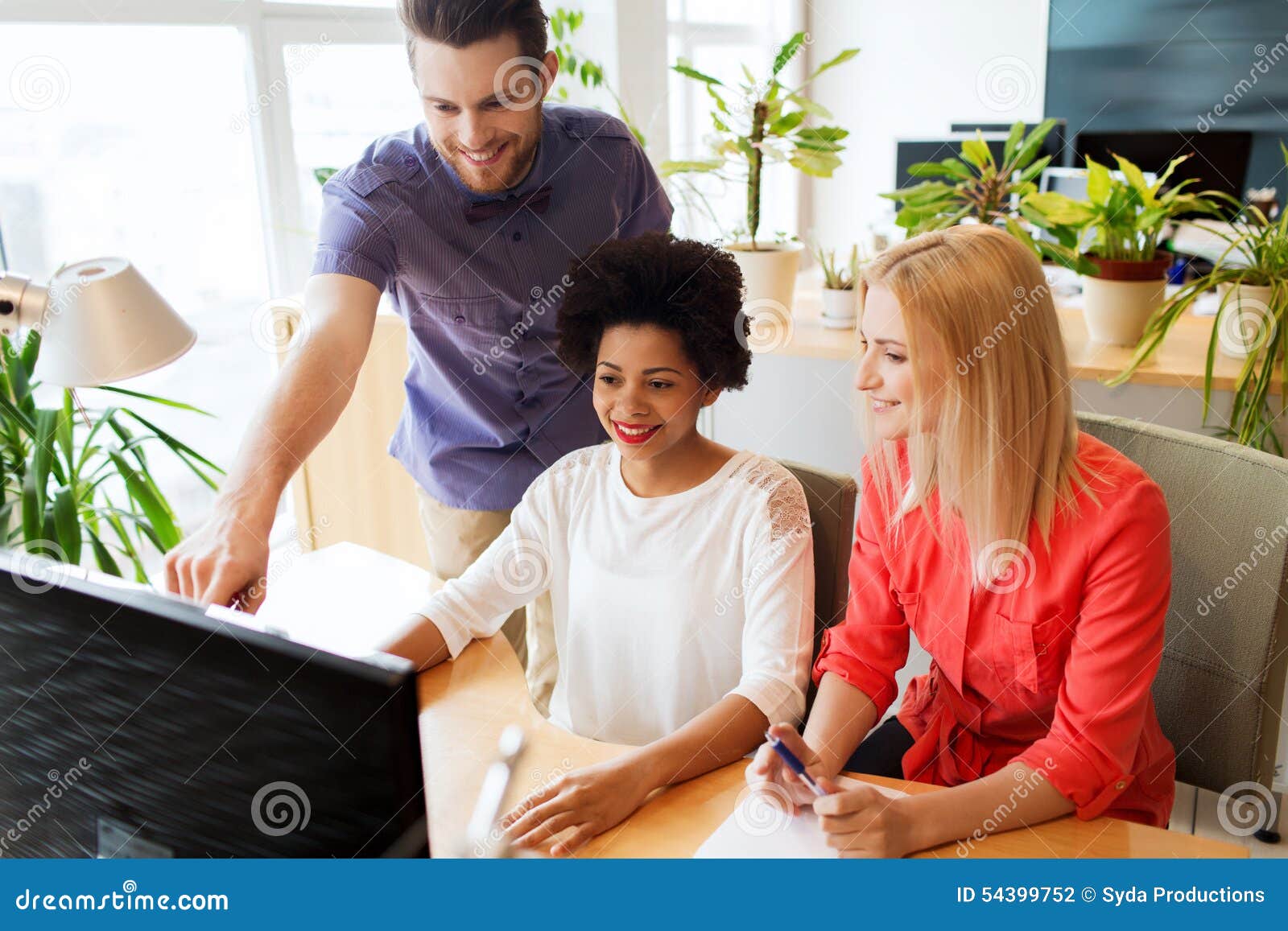 Happy Creative Team with Computer in Office Stock Photo - Image of ...