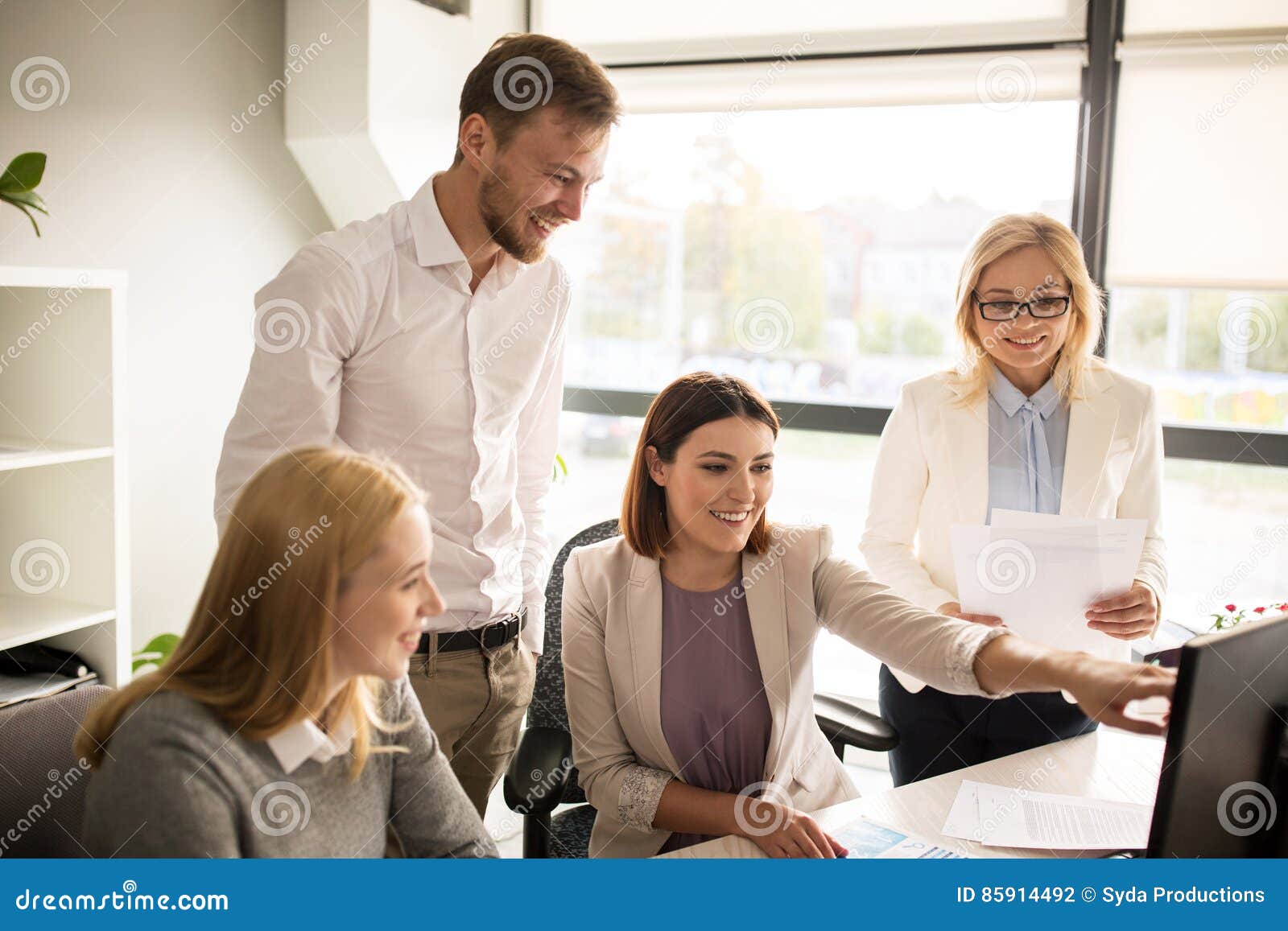 Happy Creative Team with Computer in Office Stock Photo - Image of ...