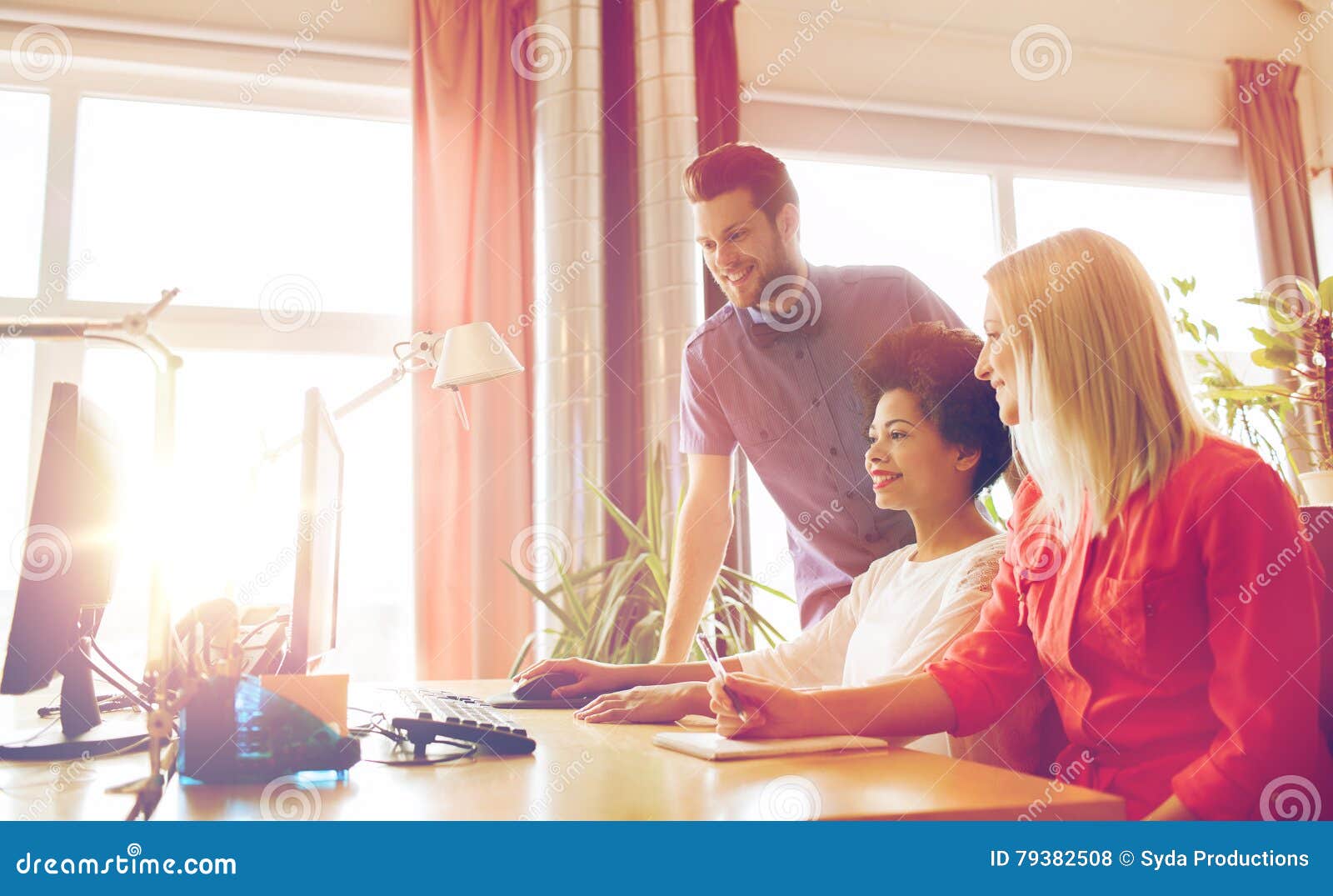 Happy Creative Team with Computer in Office Stock Photo - Image of ...