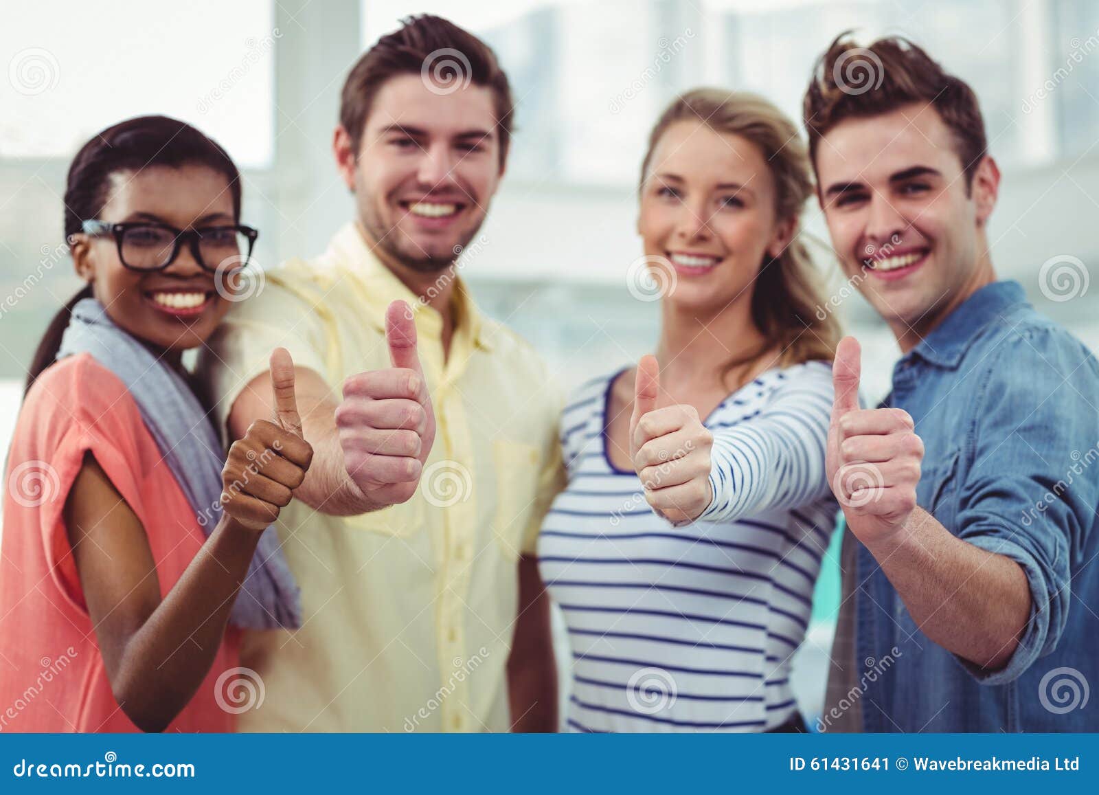 Happy Creative Team Giving the Thumbs Up Stock Image - Image of ...