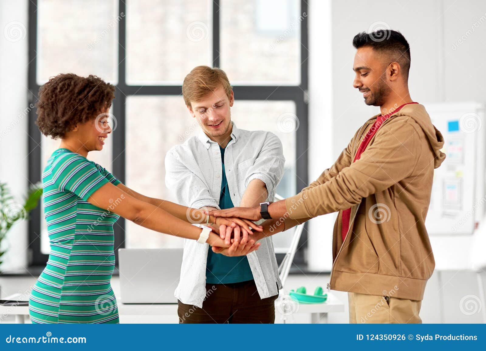 Happy Creative Team Stacking Hands at Office Stock Photo - Image of ...