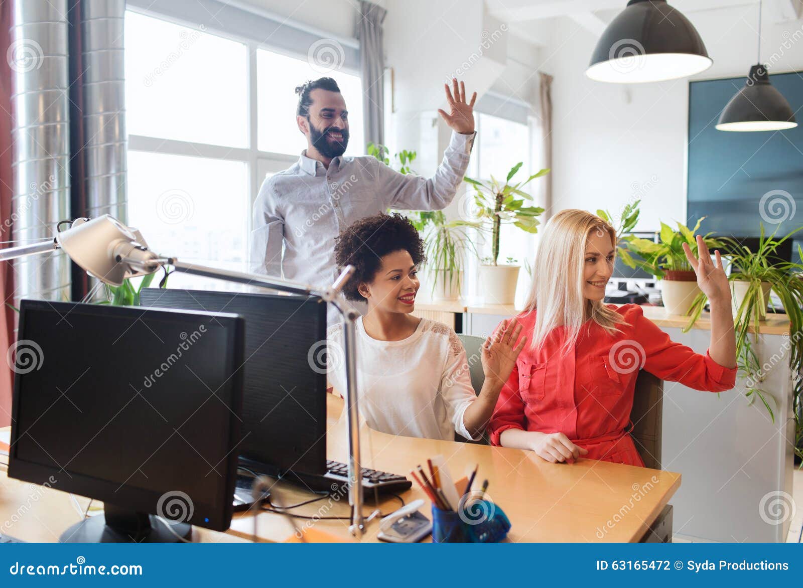 Happy Creative Team Waving Hands in Office Stock Photo - Image of ...