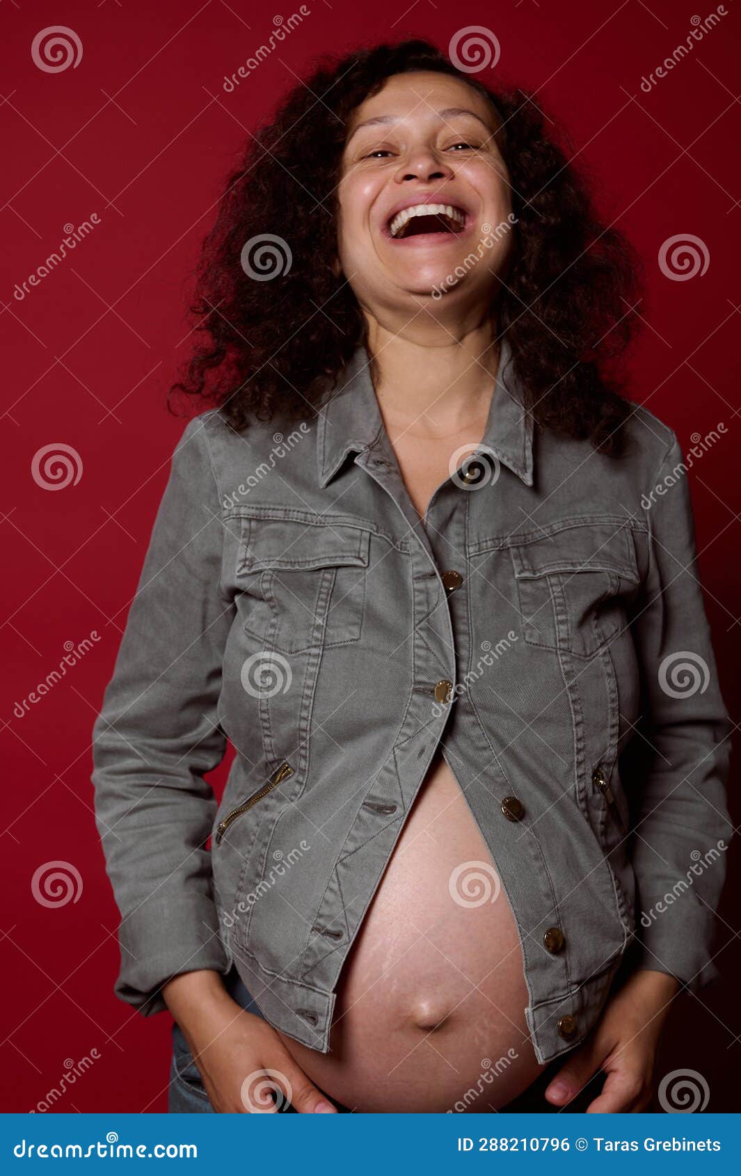 Happy Pregnant Woman With Naked Belly Wearing Stylish Casual Denim