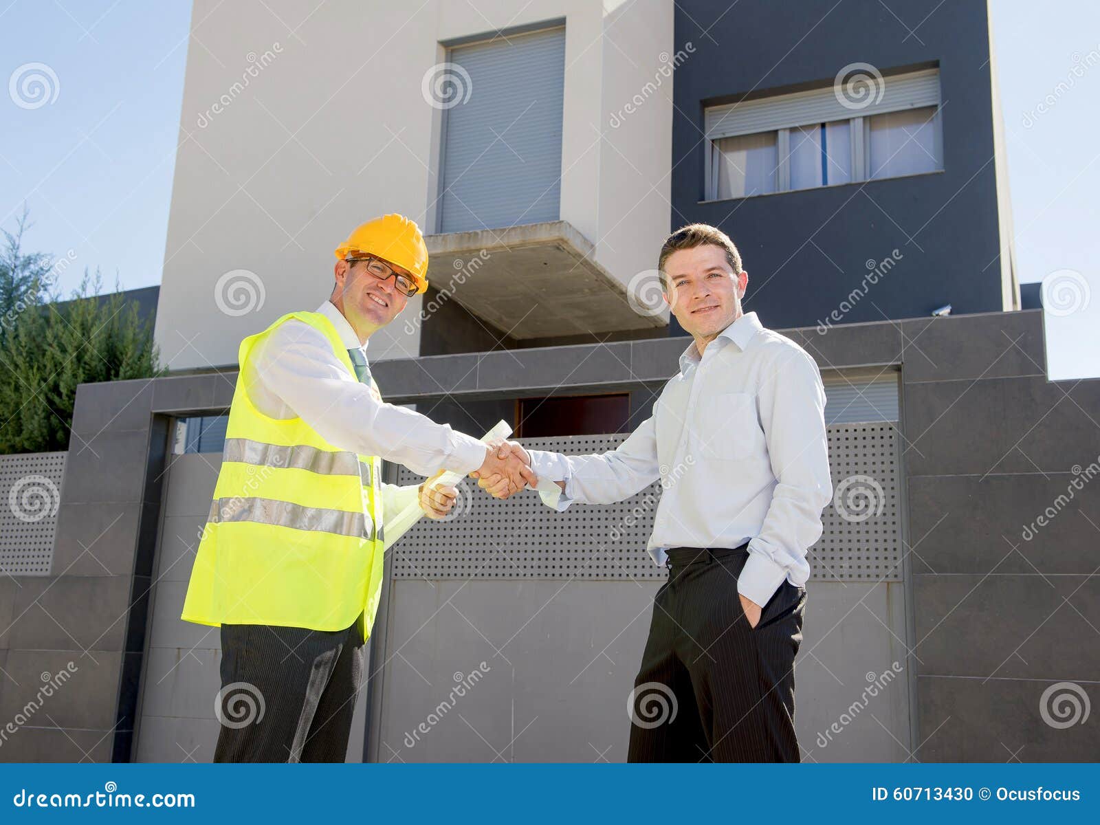 Happy Customer Smiling and Constructor Foreman Worker Shacking Hands As ...