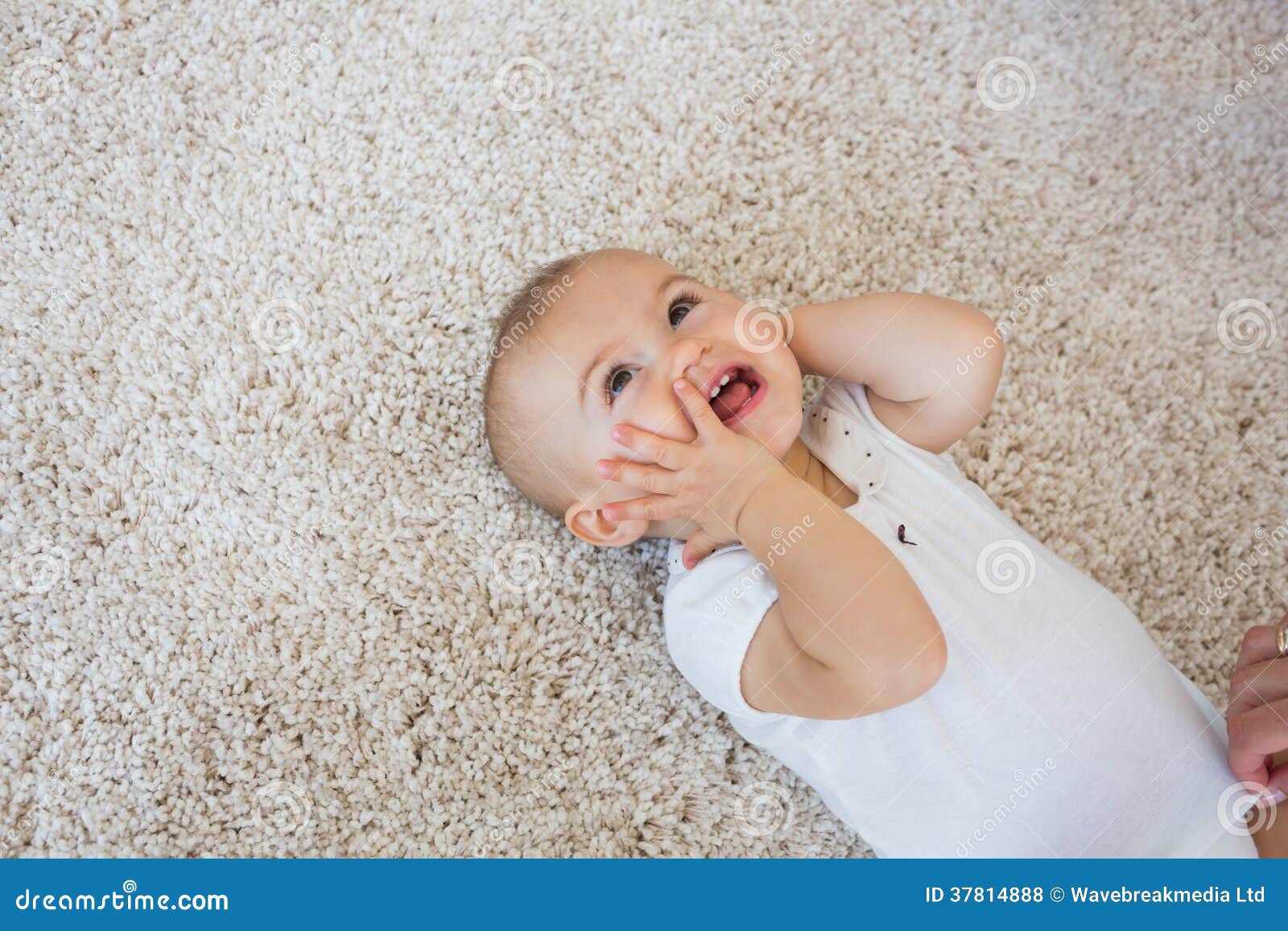 Happy Cute Baby Lying on Carpet Stock Photo - Image of face, house ...