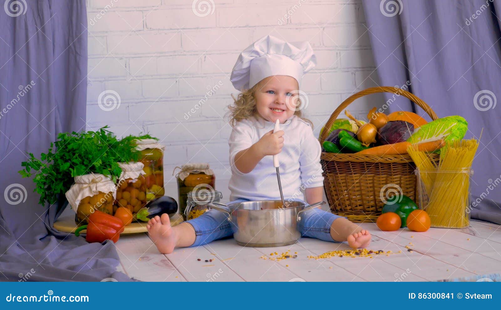 Happy Cute Kid in Chef`s Hat in the Kitchen Laughing, Playing. Stock ...