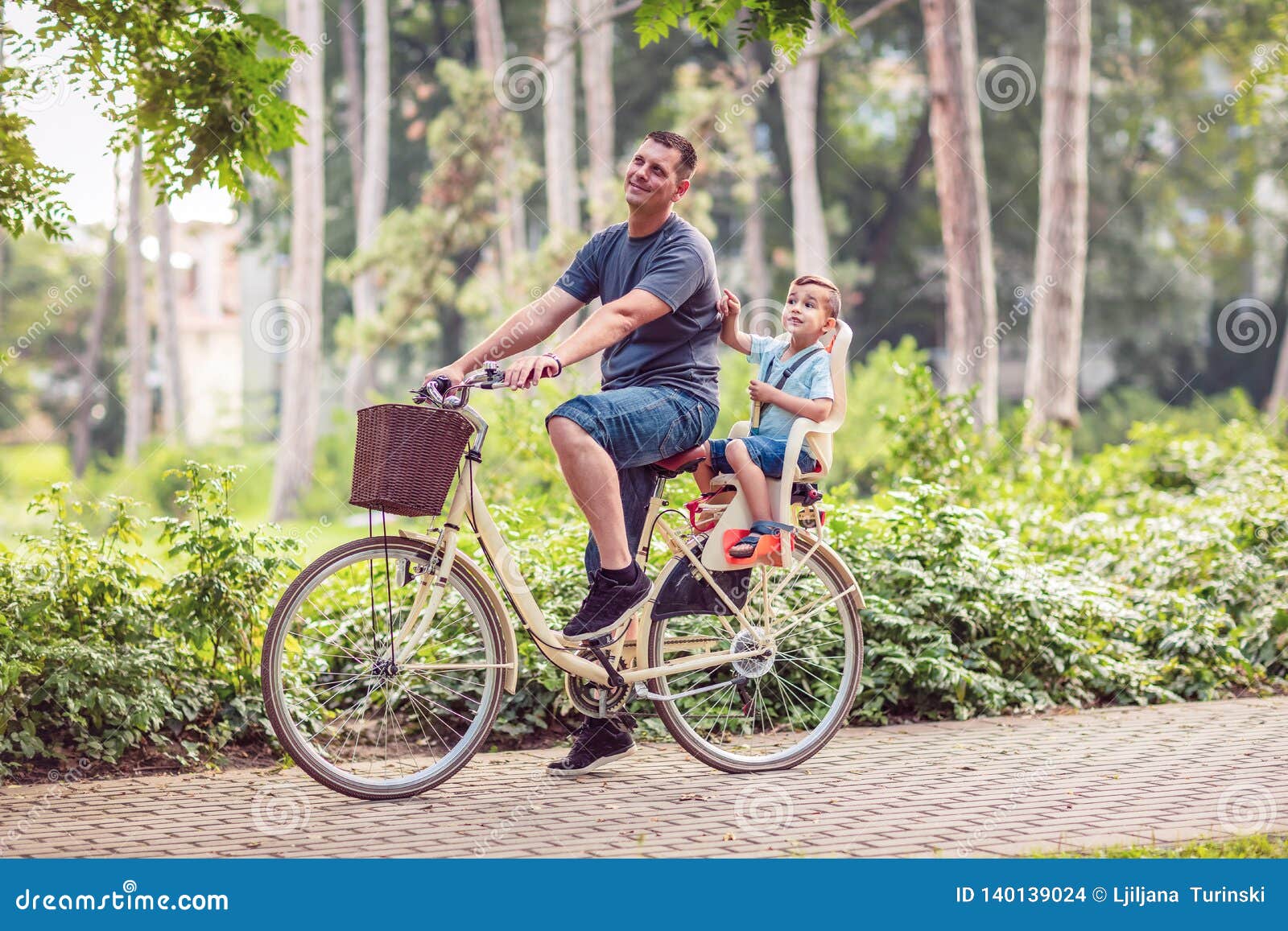 Happy Dad and Son Riding Bicycles Outdoors Stock Photo - Image of bike ...