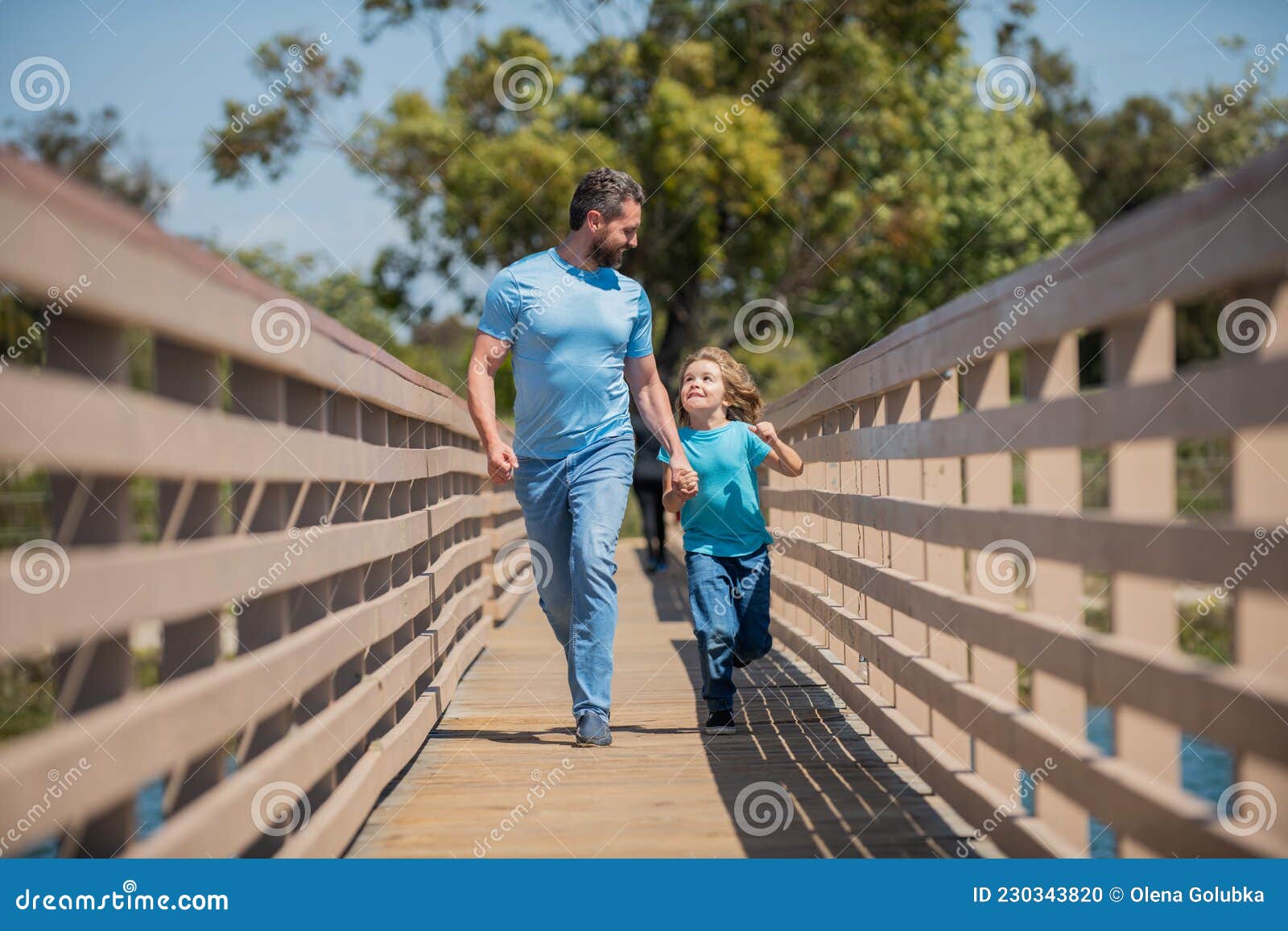 Happy Daddy Having Fun Running with His Son Outdoor, Adoption Stock ...