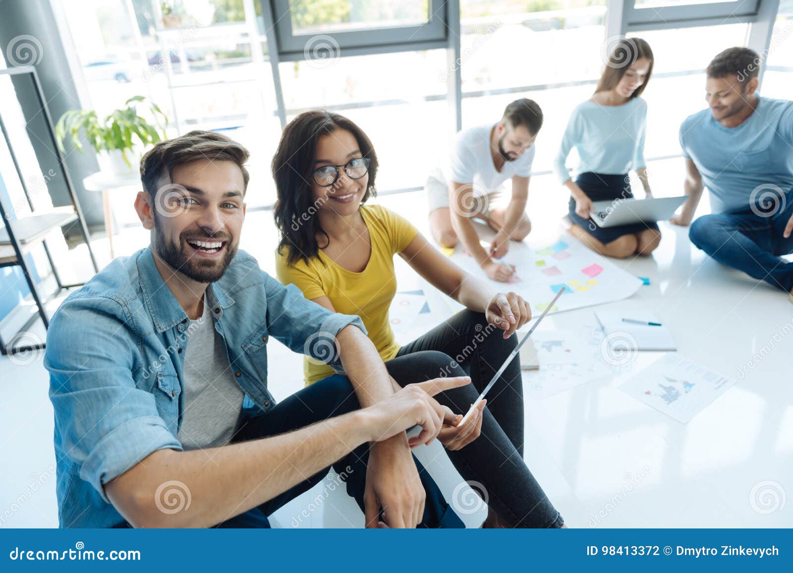 Happy Delighted People Sitting on the Floor Stock Photo - Image of ...