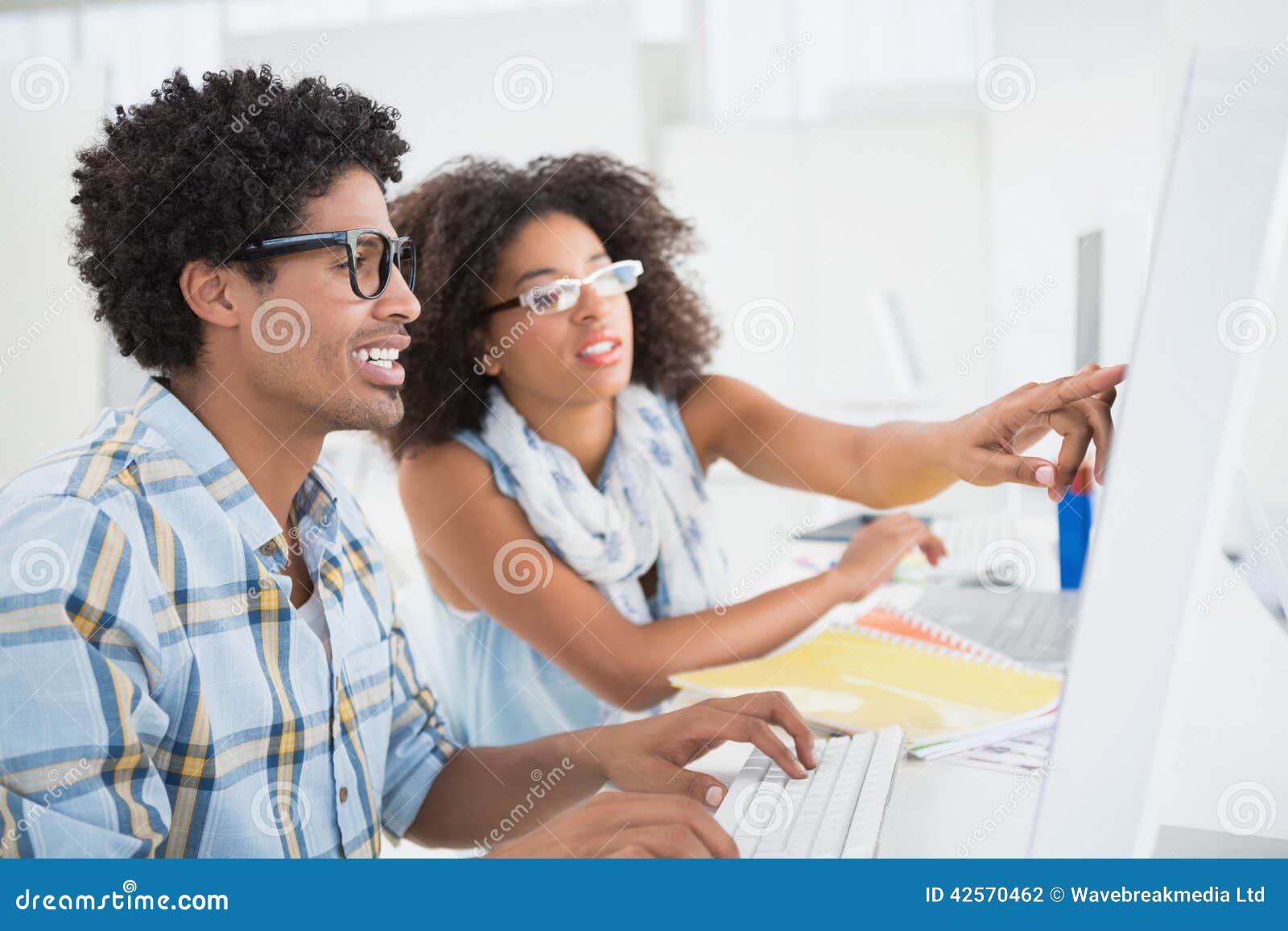 Happy Design Team Working at Desk Together Stock Photo - Image of ...