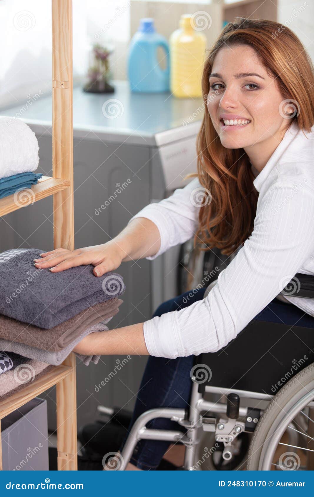 Happy Disable Woman Putting Away Laundry Stock Photo - Image of laundry ...