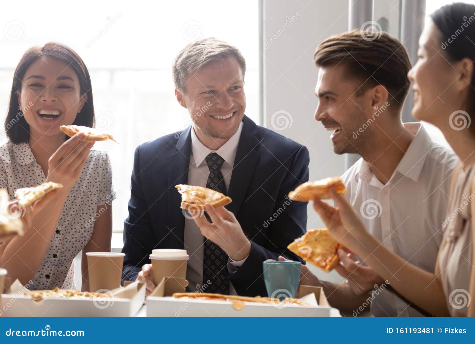 Happy Diverse Employees Colleagues Sharing Meal At Lunch Break Stock