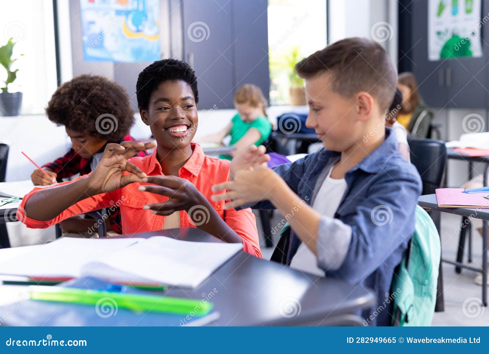 Happy, Diverse Female School Teacher and Boy Practicing Sign Language ...