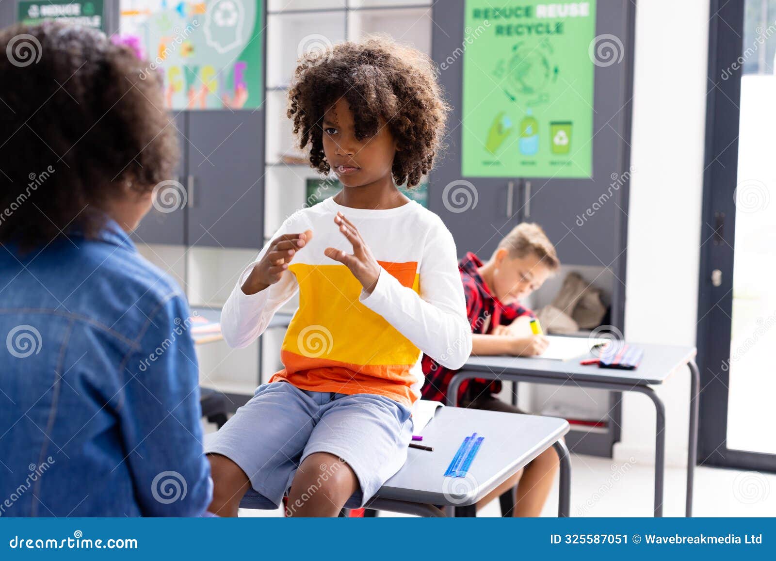 Happy Diverse Schoolchildren Using Sign Language in School Classroom ...