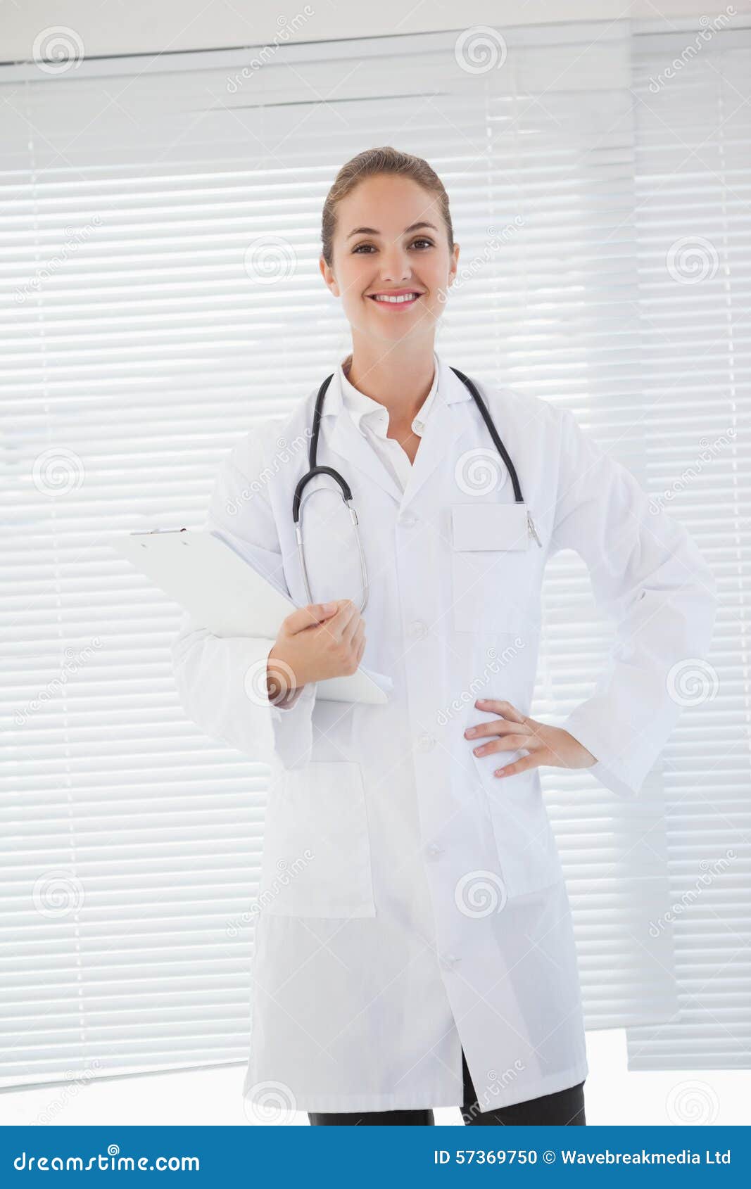Happy Doctor Holding a Clipboard Stock Photo - Image of stethoscope ...