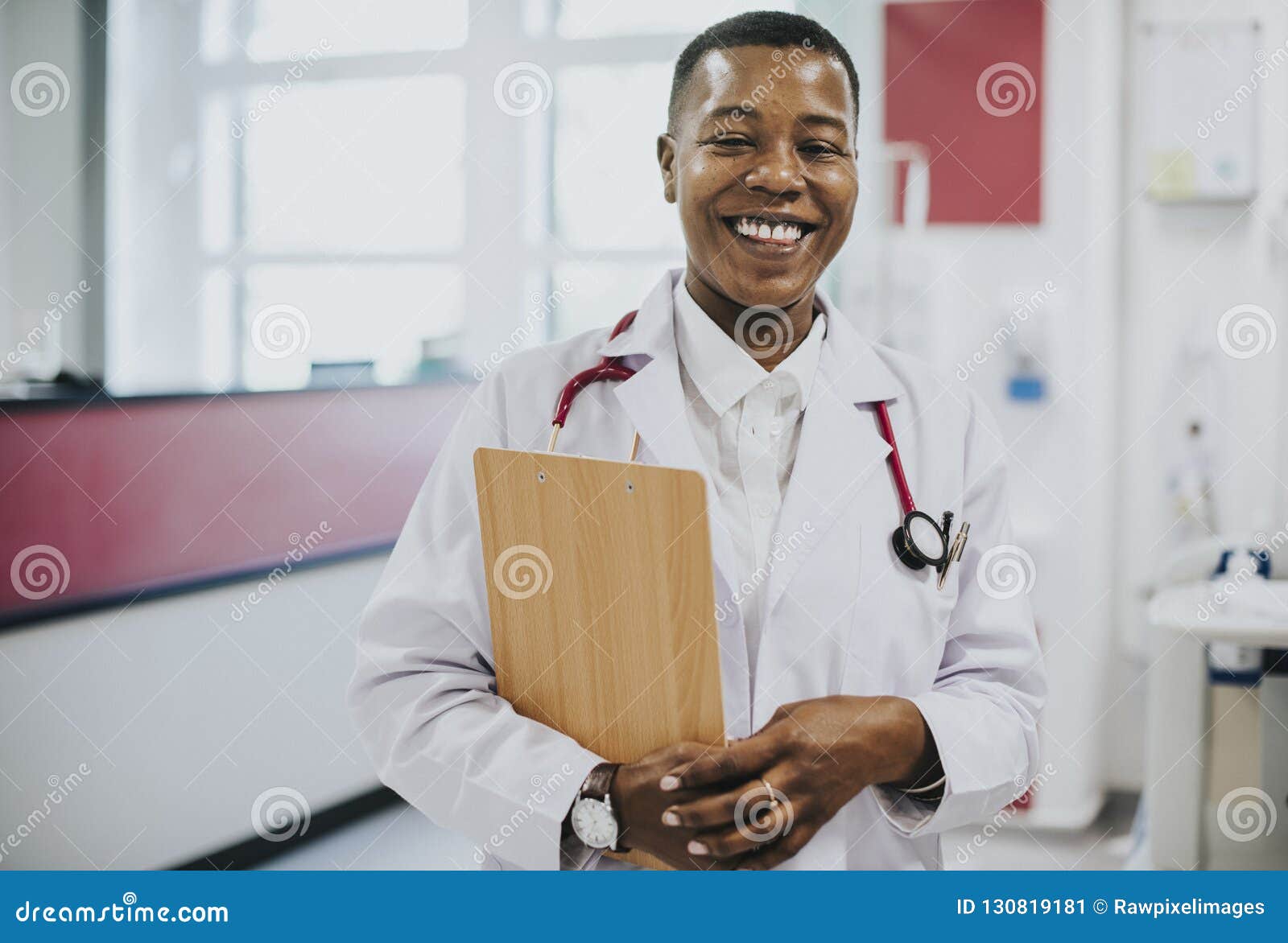 Happy doctor at a hospital stock image. Image of healthcare - 130819181