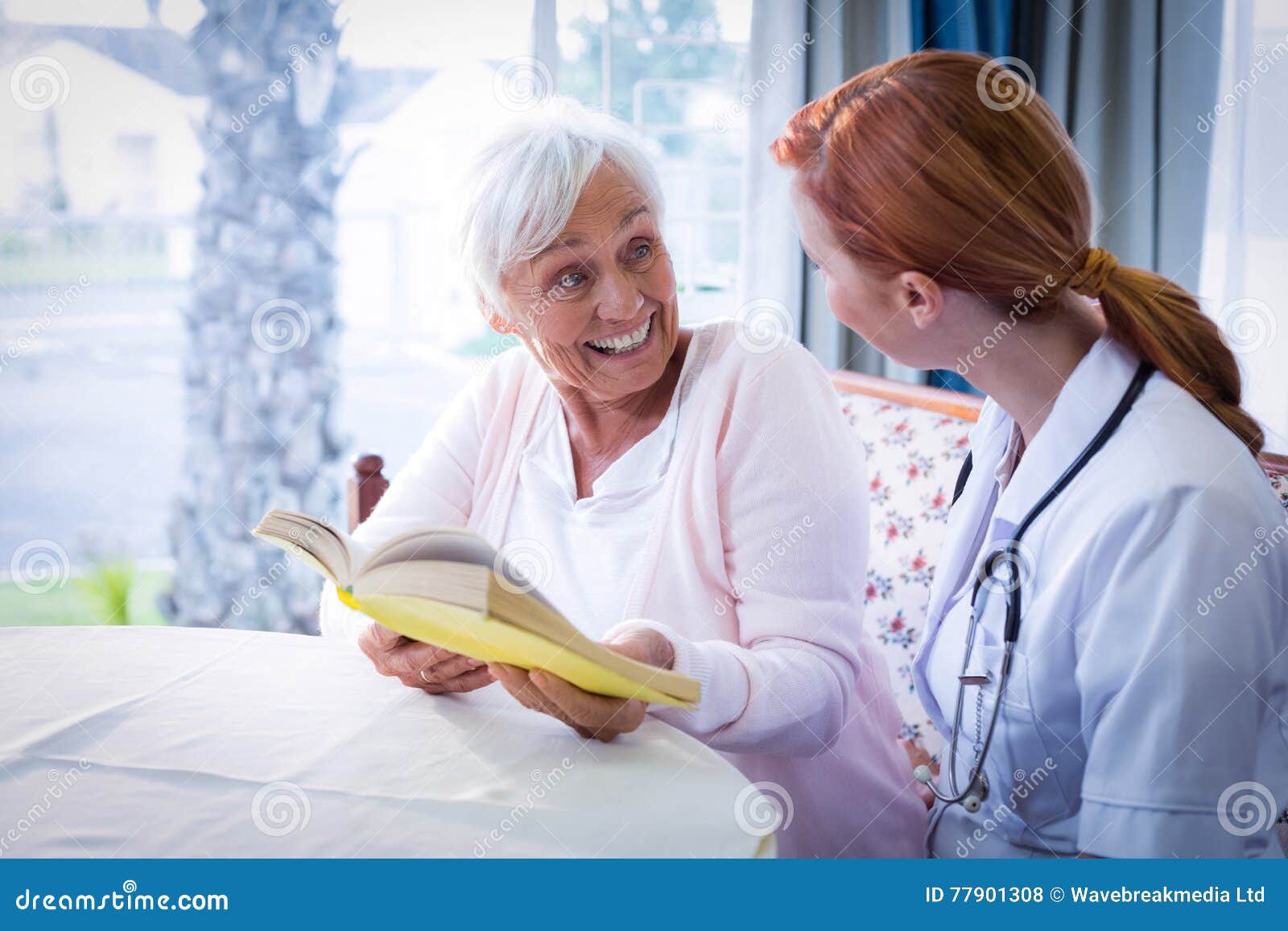 Happy Doctor and Patient Reading a Book Stock Photo - Image of grey ...