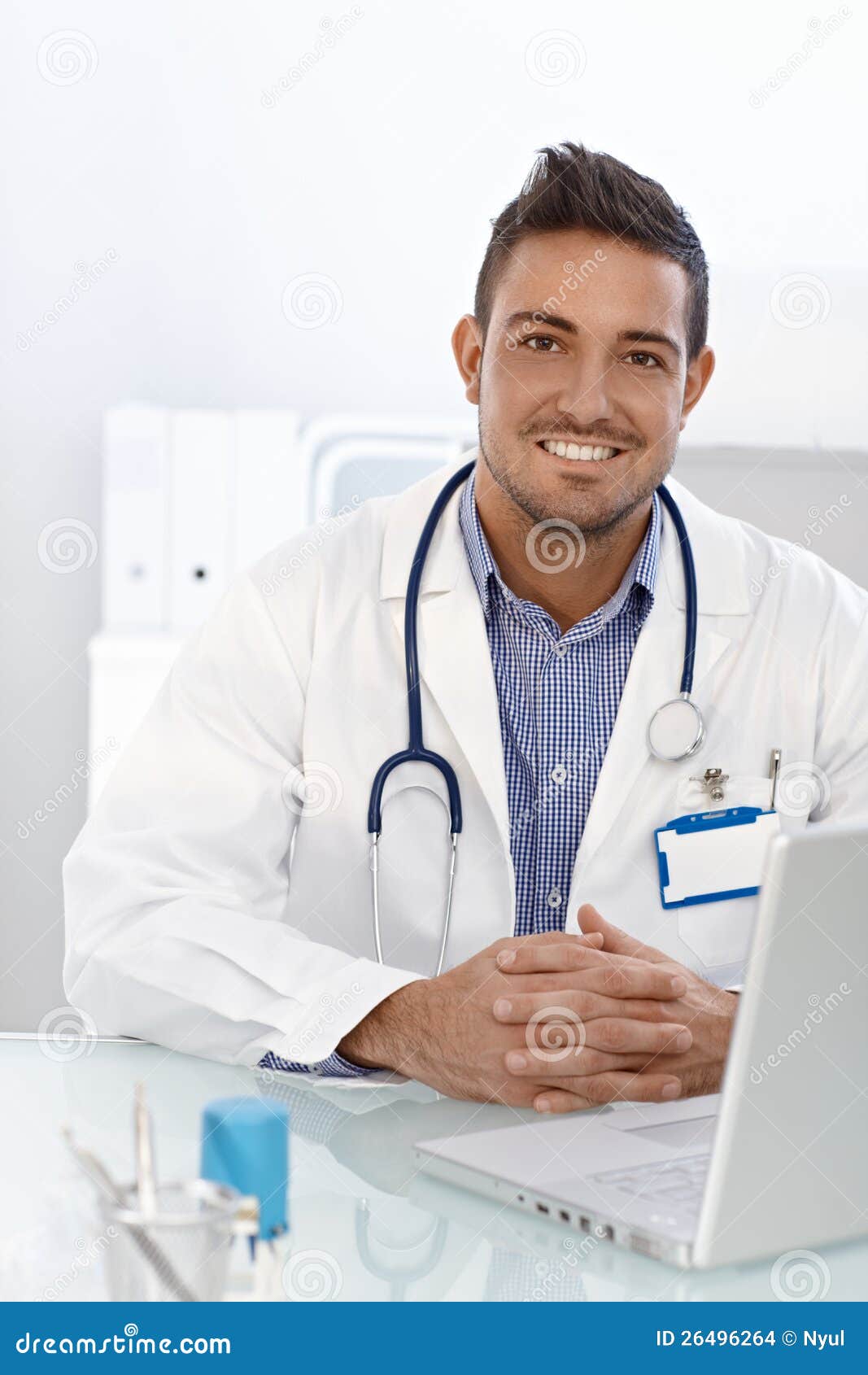 Happy Doctor Sitting at Desk Stock Photo - Image of doctors, laptop ...