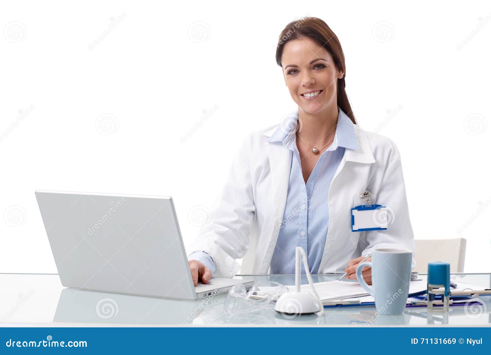 Happy doctor using laptop stock image. Image of attractive - 71131669