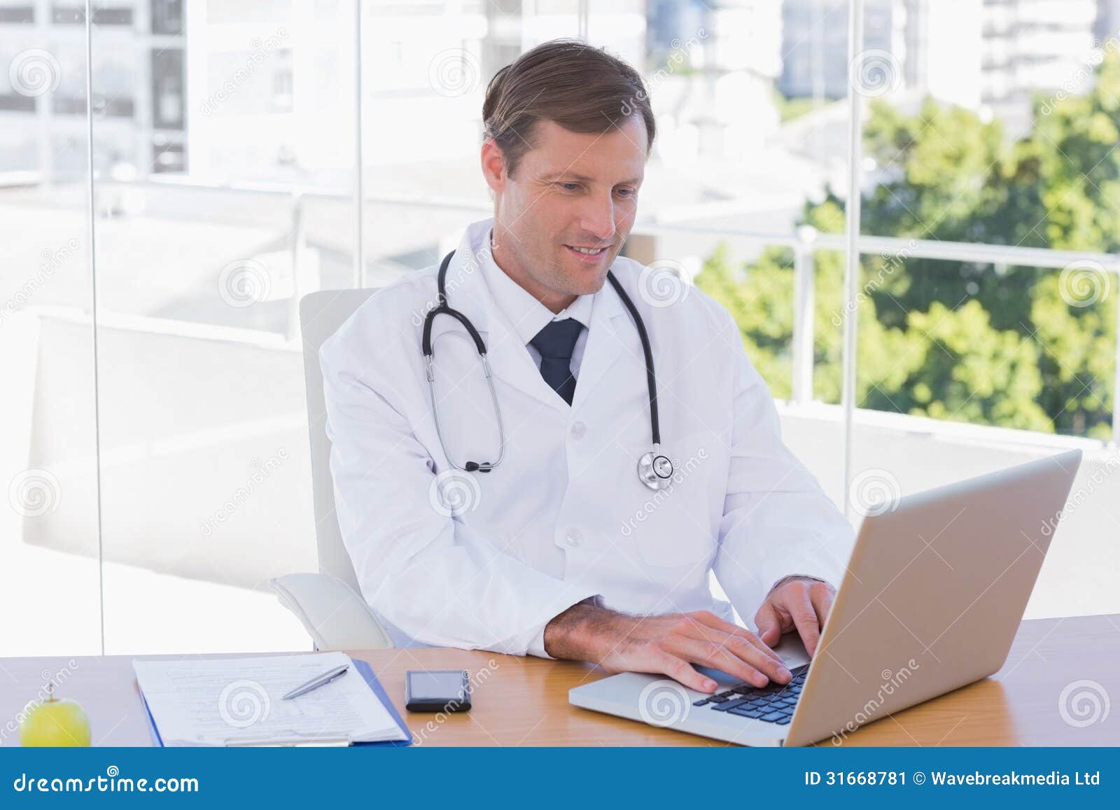 Happy Doctor Working on a Laptop Stock Image - Image of smartphone ...