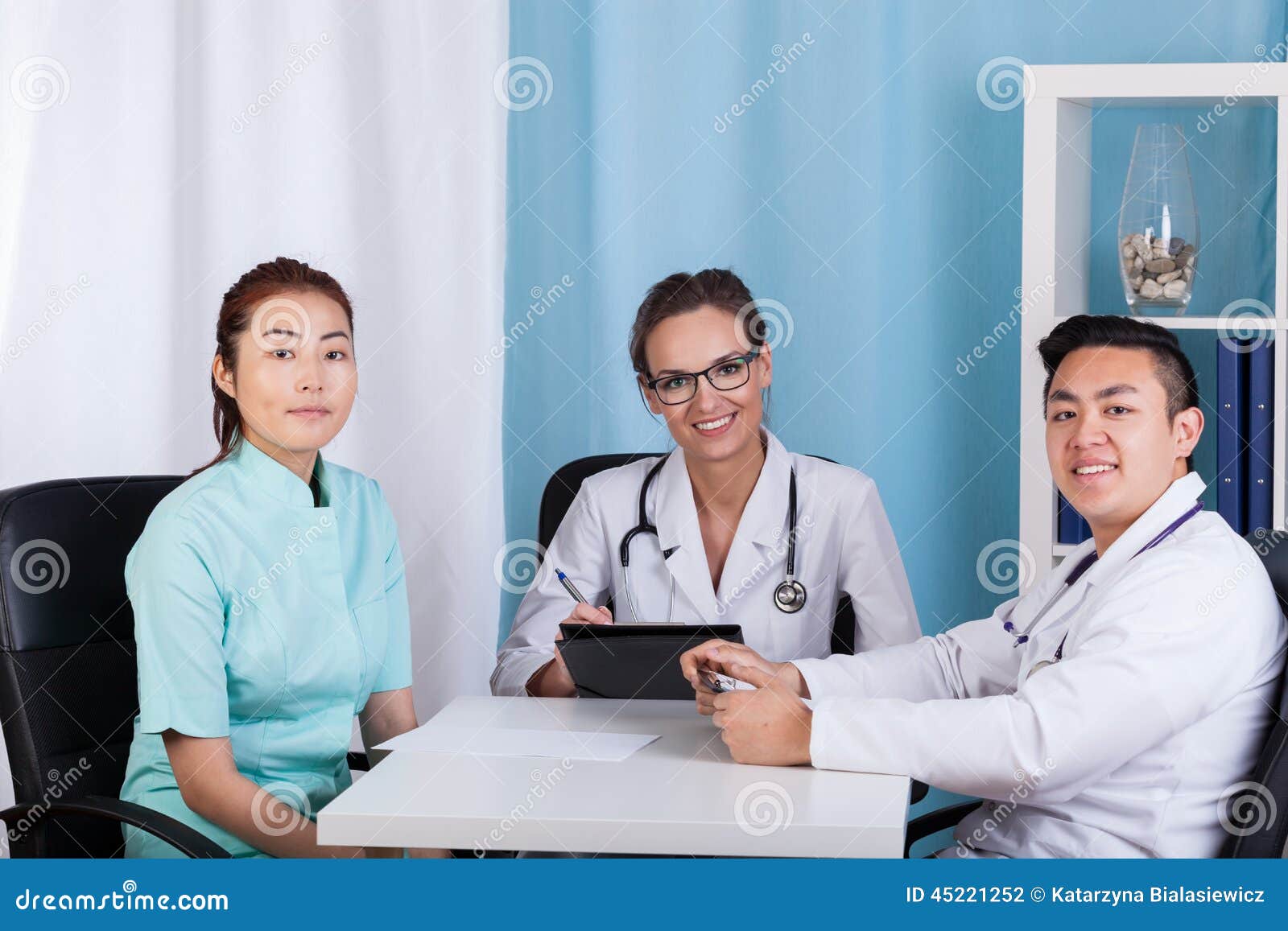 Happy Doctors Talking in the Office Stock Photo - Image of apron ...