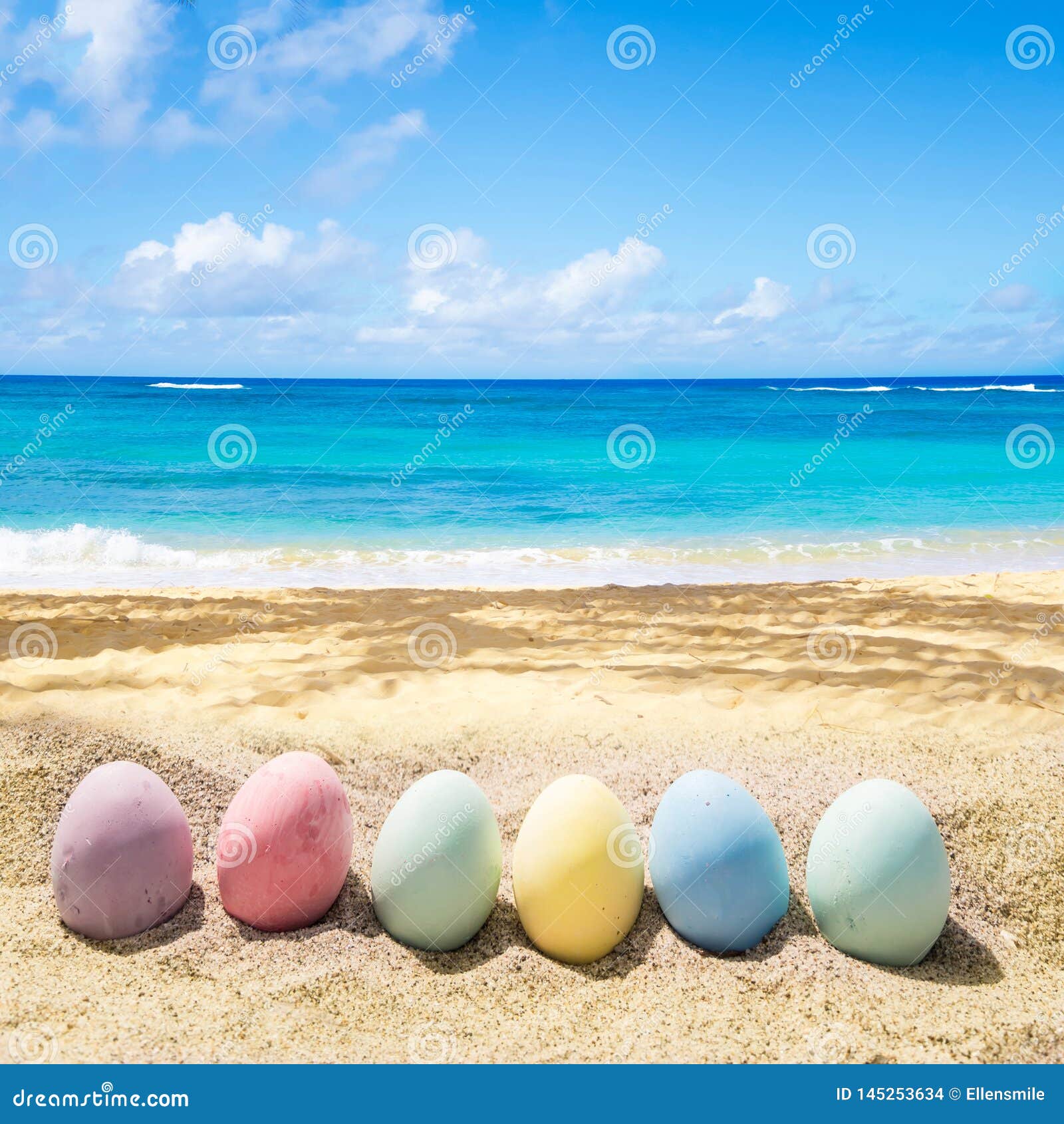 Happy Easter Lettering Background with Eggs on the Sandy Beach Stock ...