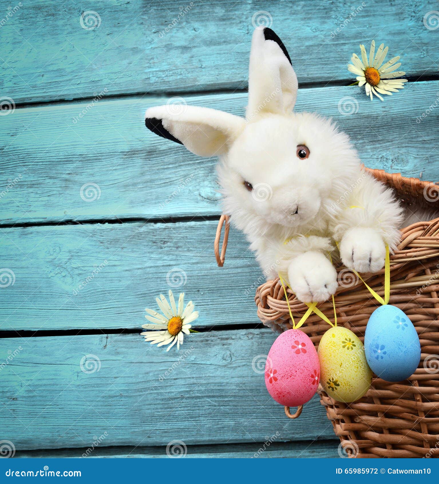 Happy Easter Bunny in Basket and Eggs on Blue Background. Stock Photo ...
