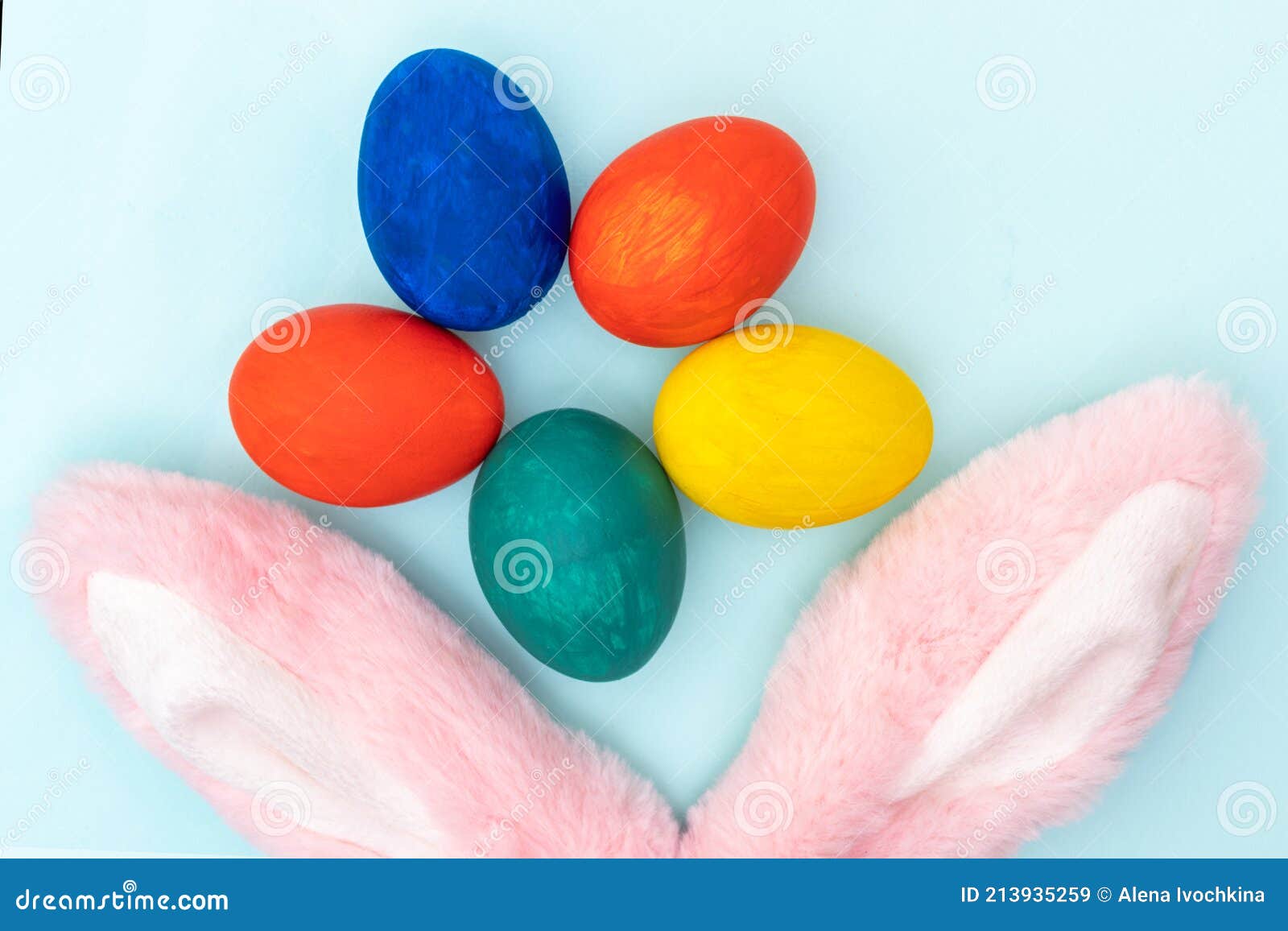 Happy Easter Concept. Hand-painted Easter Eggs and Pink Bunny Ears on a ...