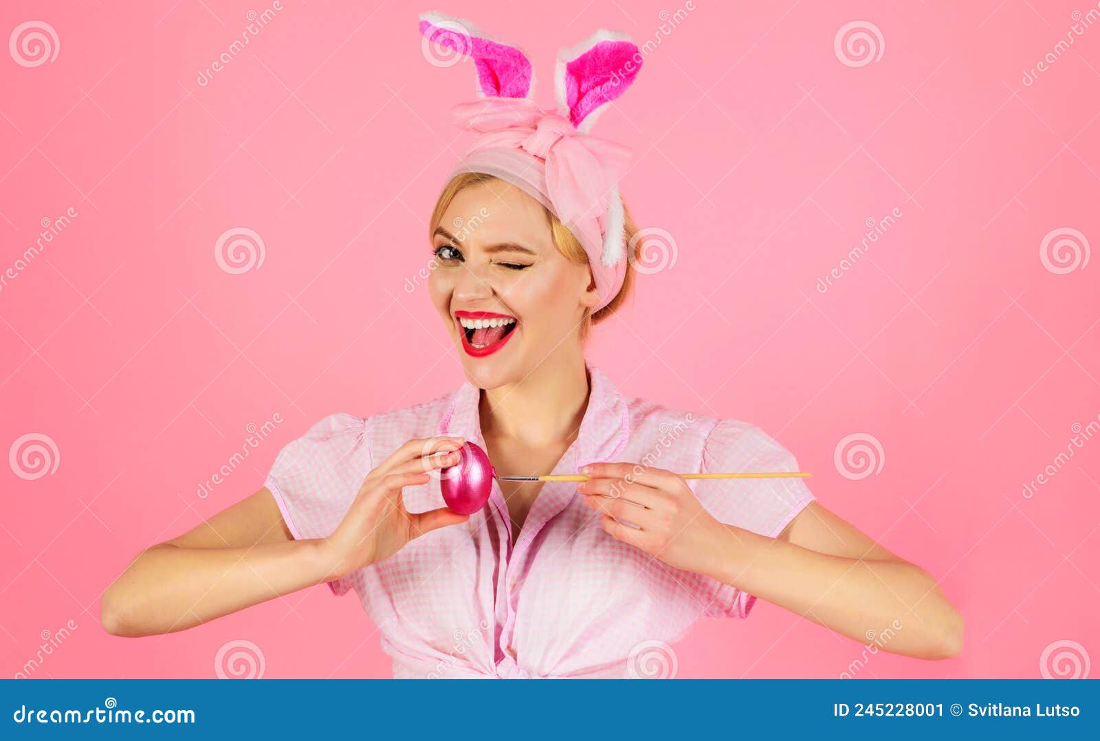 Happy Easter Day Winking Woman In Rabbit Ears Decorating Eggs Smiling