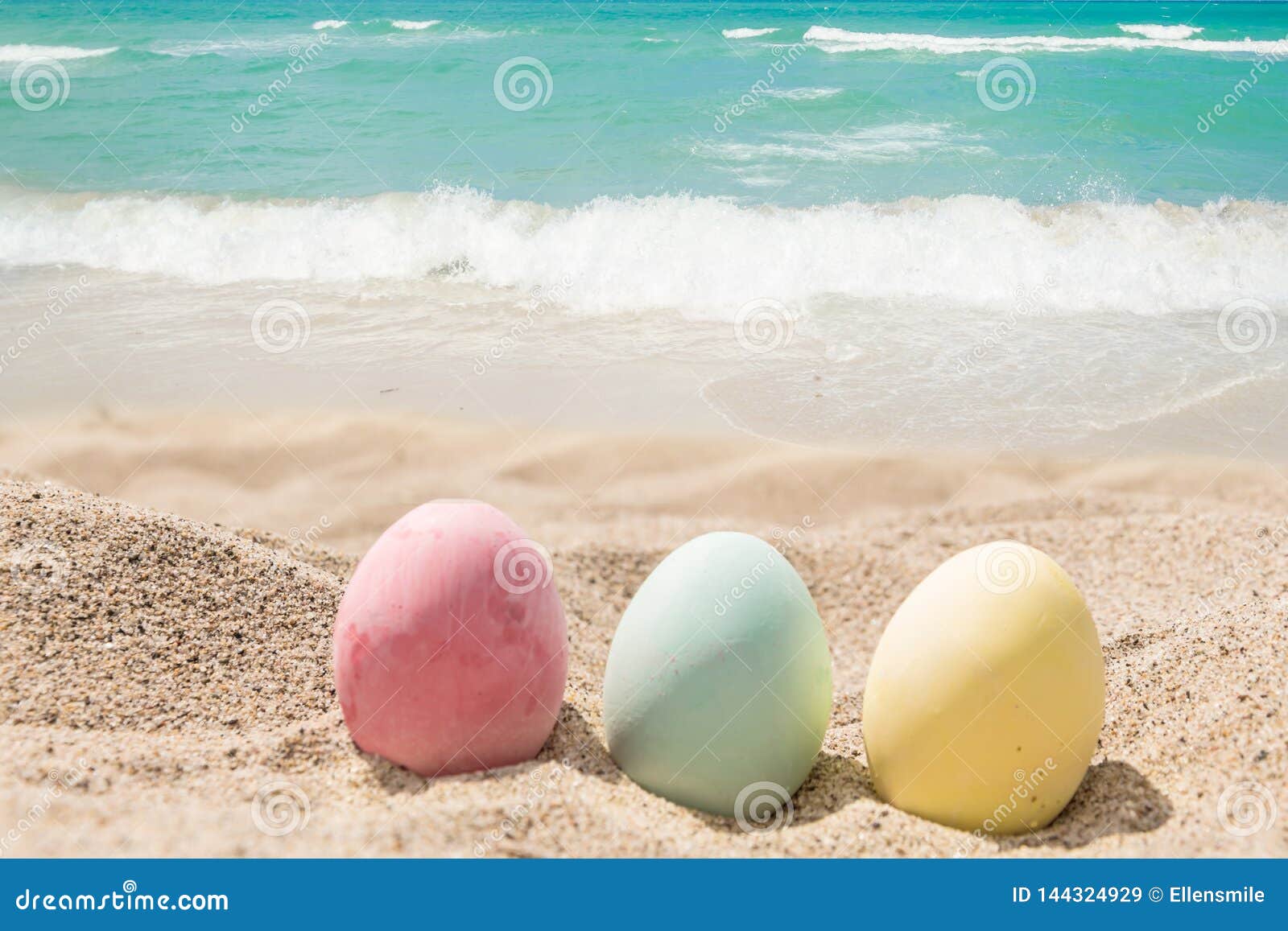 Happy Easter Lettering Background with Eggs on the Sandy Beach Stock ...