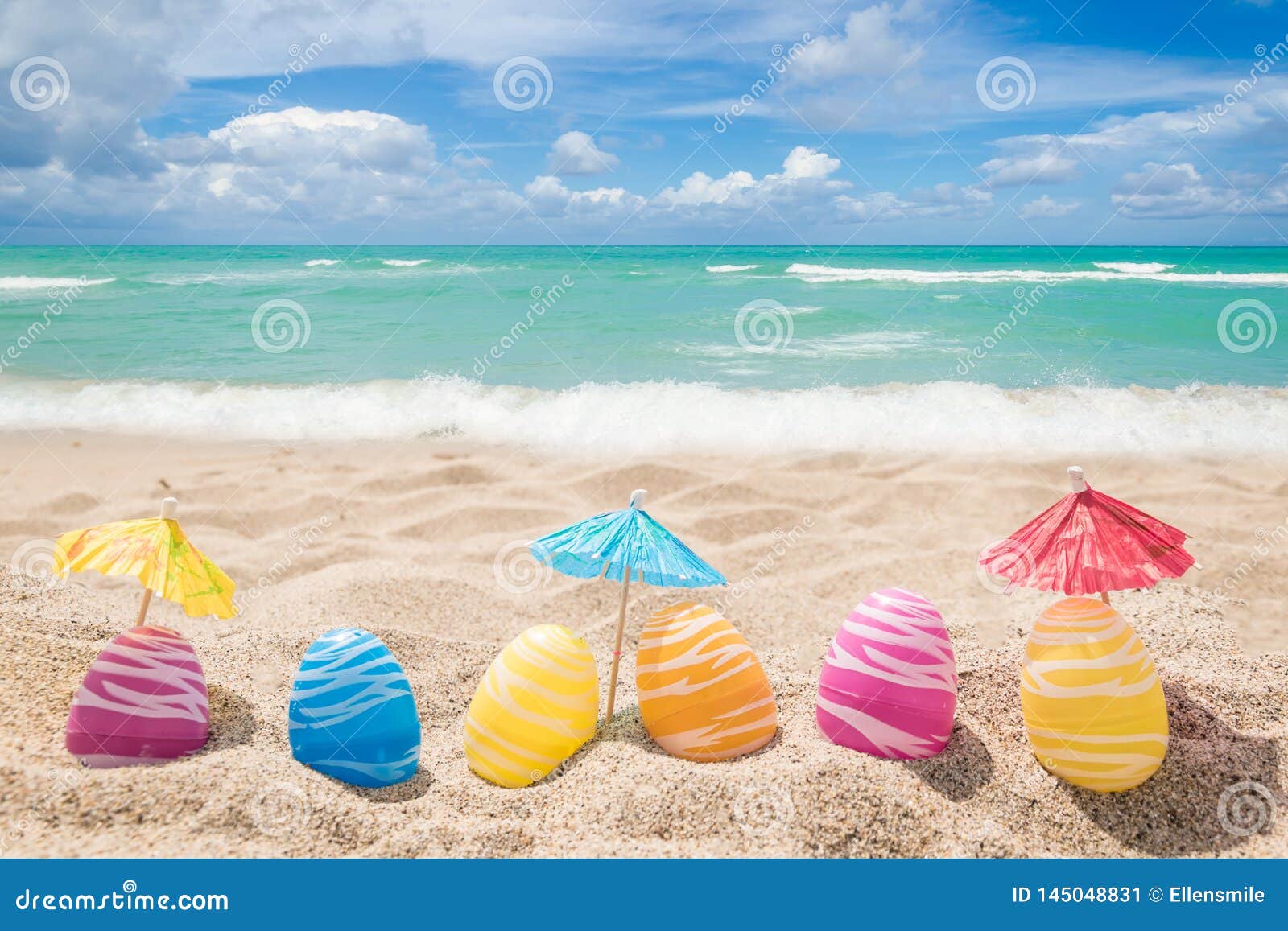 Happy Easter Lettering Background with Eggs on the Sandy Beach Stock ...